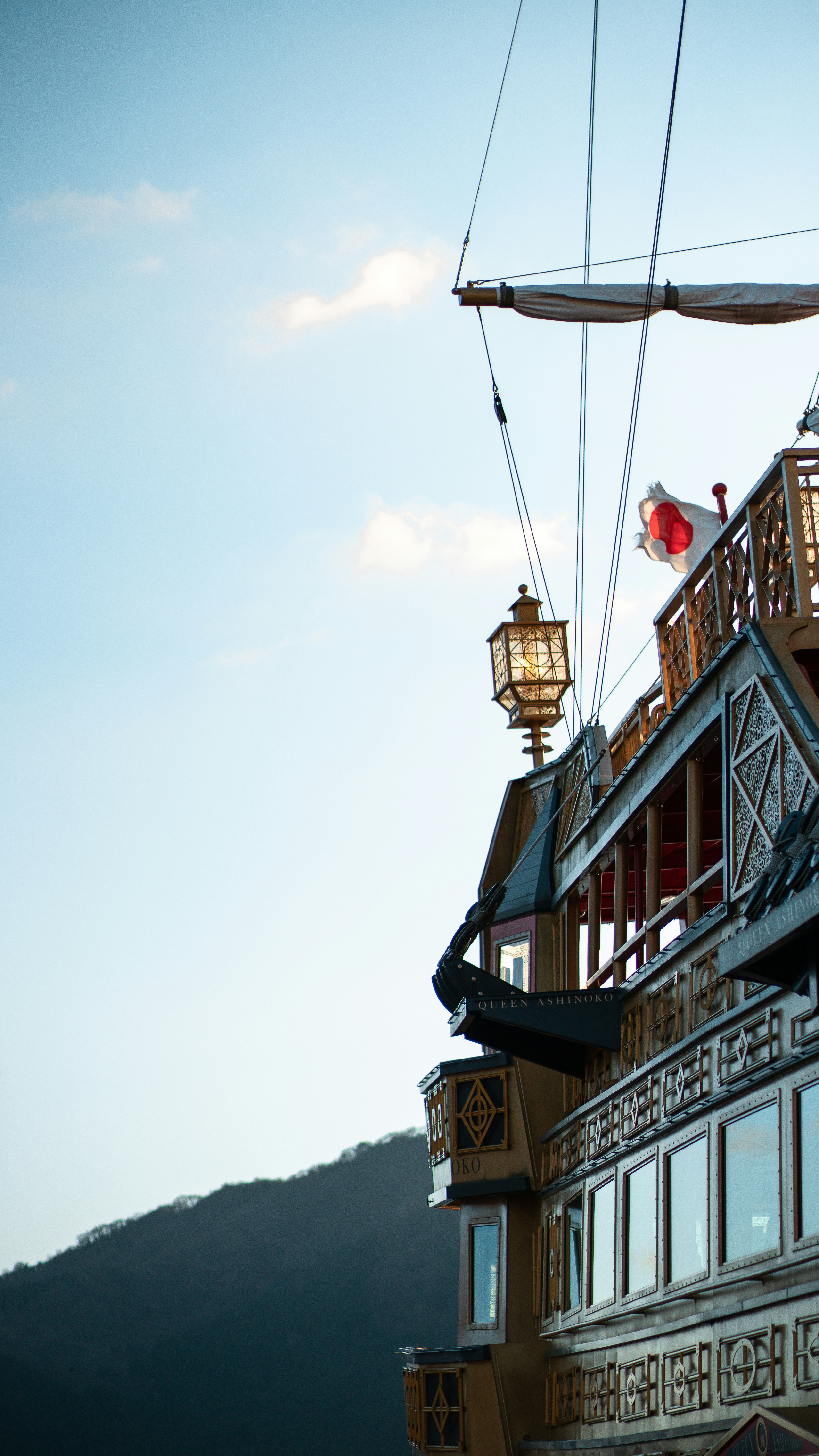 Sailing House Lanterns: A Quiet Harbor Facade Reaches Toward the Sky