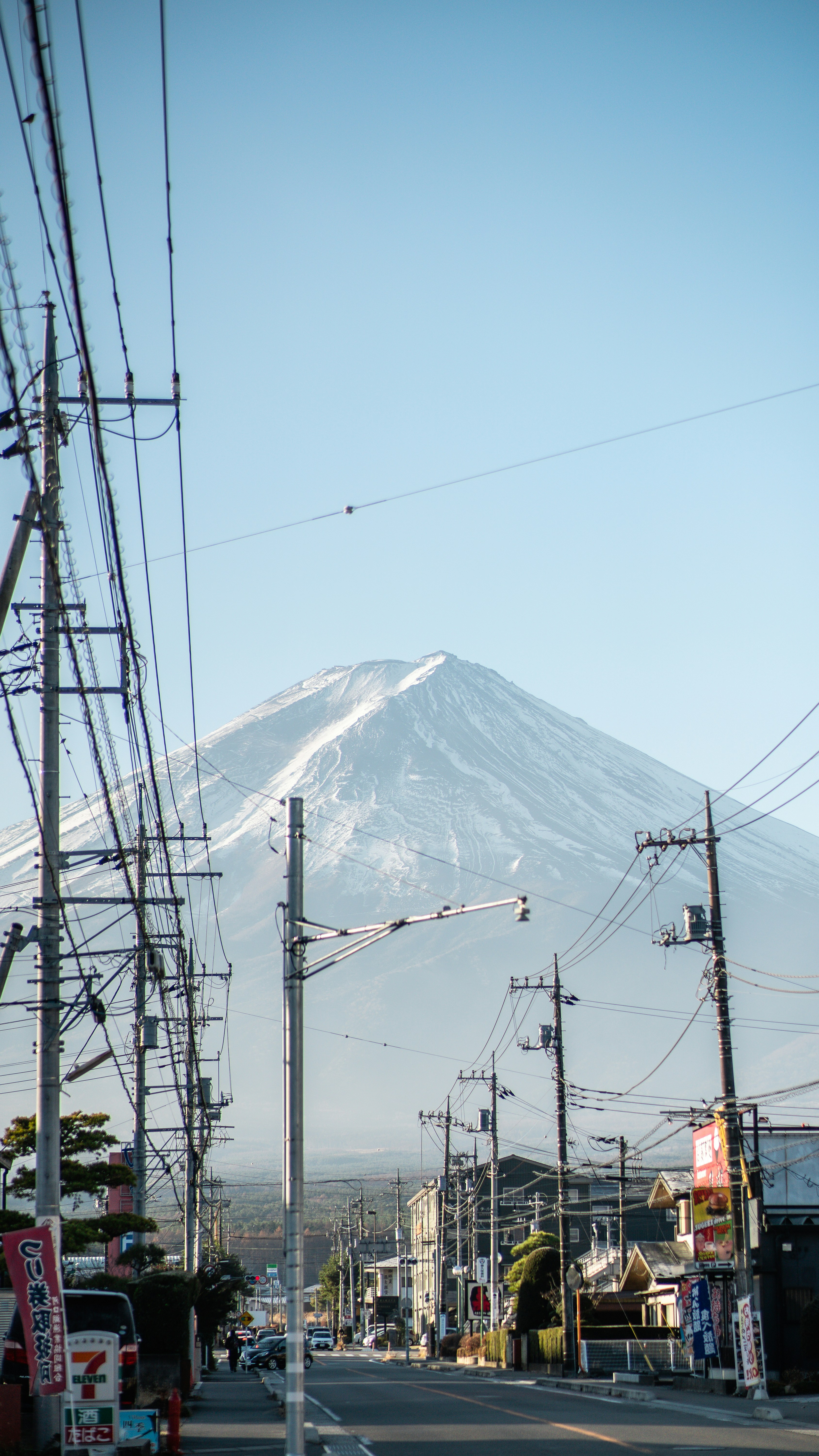 Snow-Capped Peak Over a Quiet Town Street