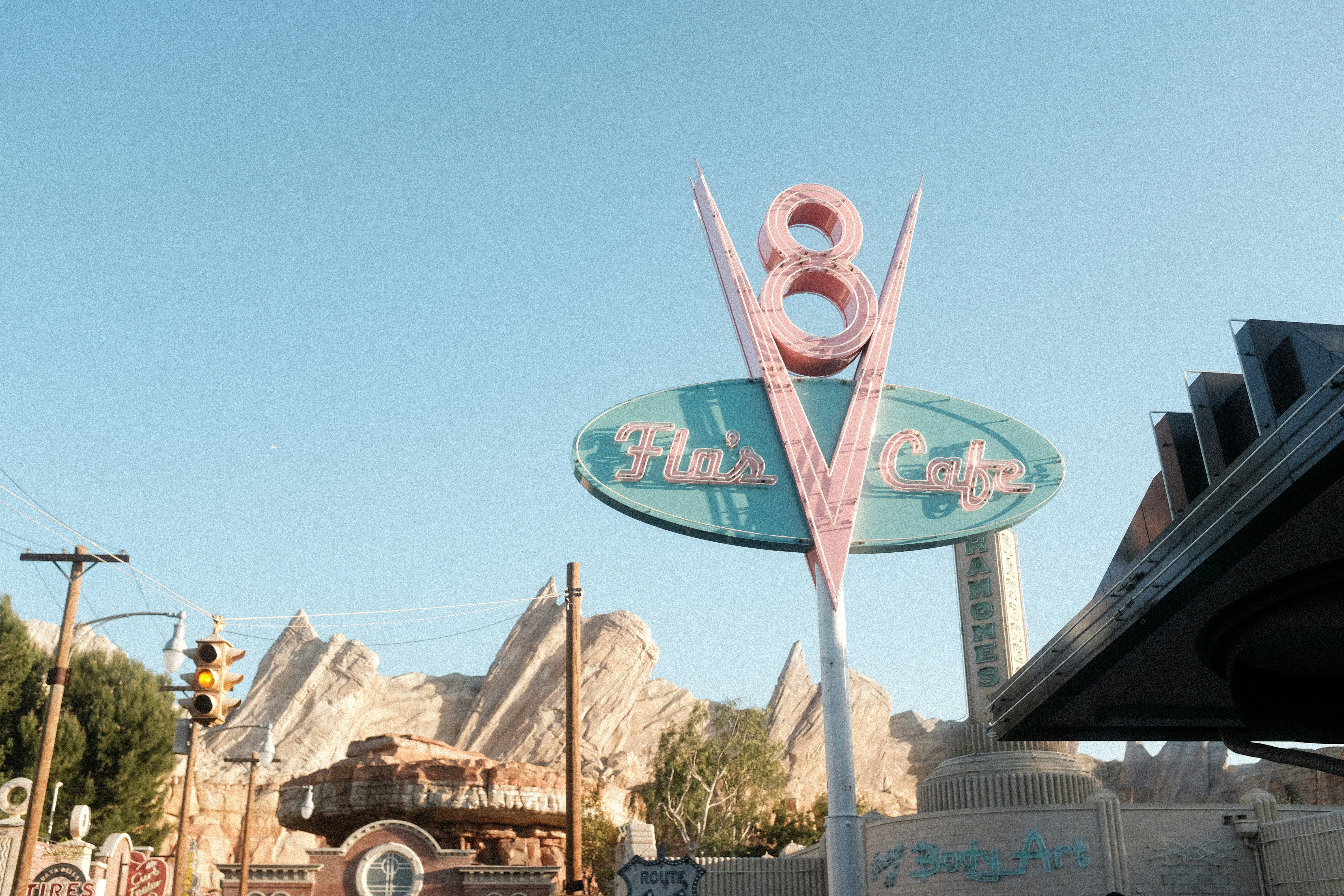 Neon V Cut Sign Over Desert Plaza
