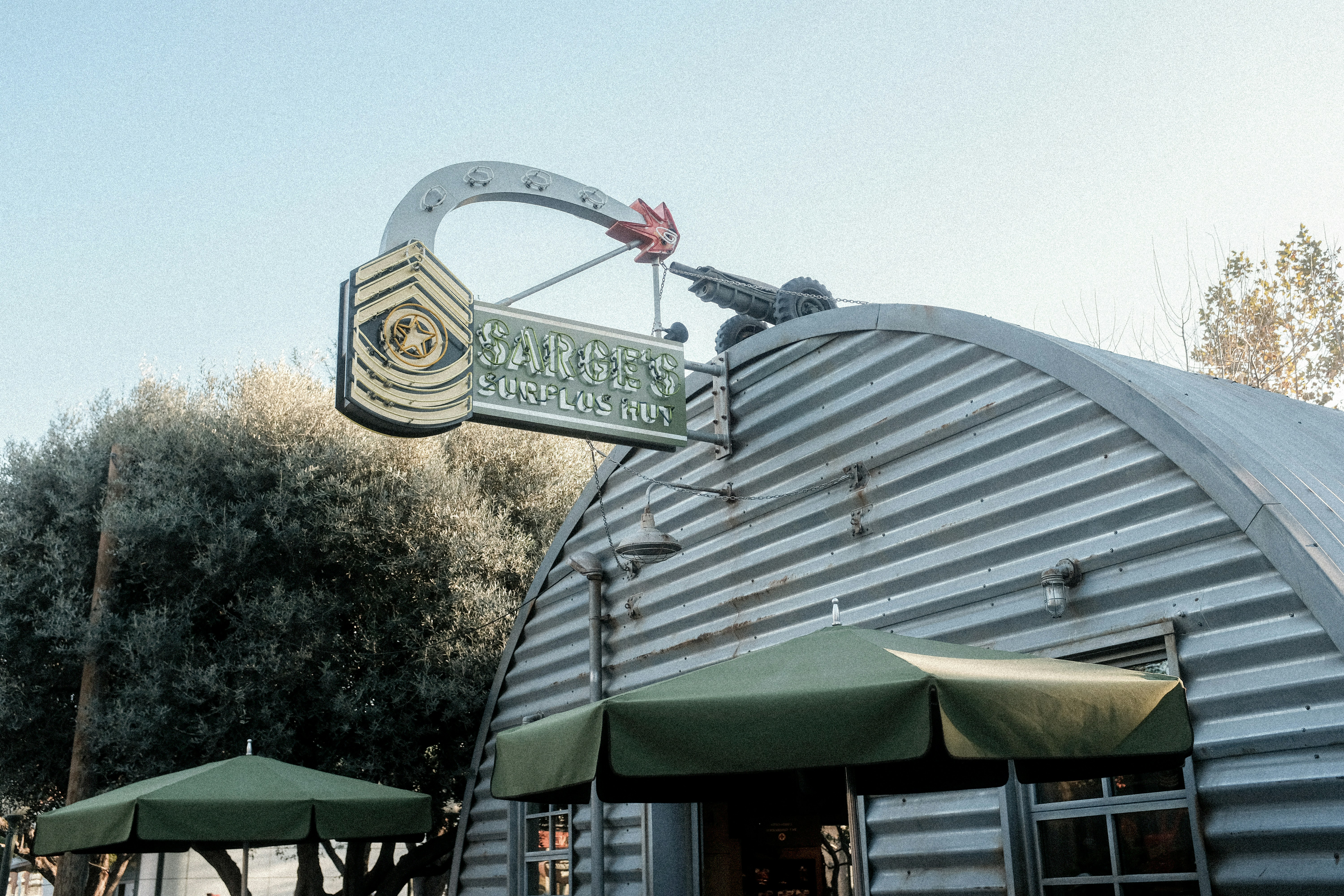 Retro Rust and Green Awnings: A Corner of the Signage Cafe