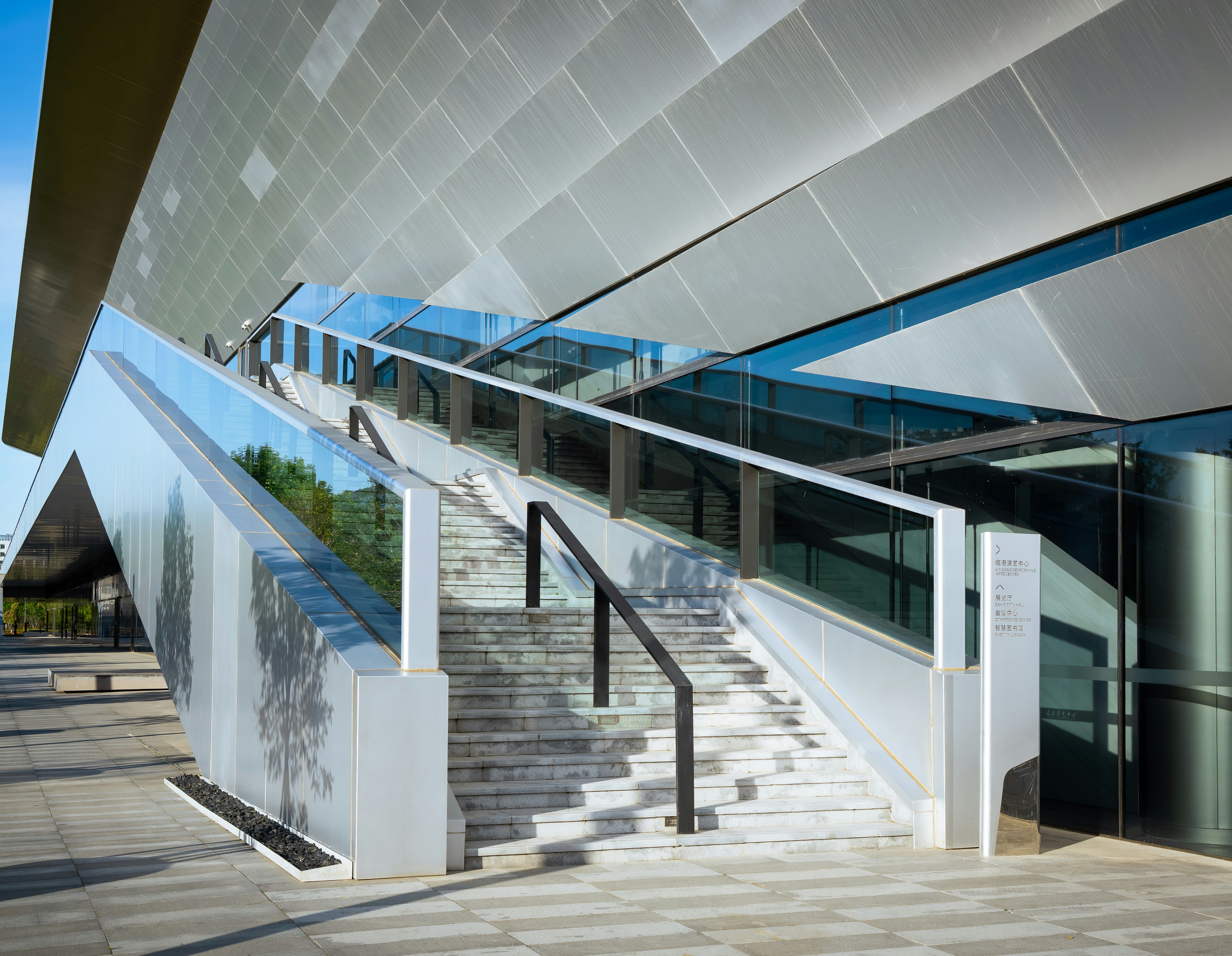 Staircase Corridor: Sunlit Angles Across a Modern Atrium