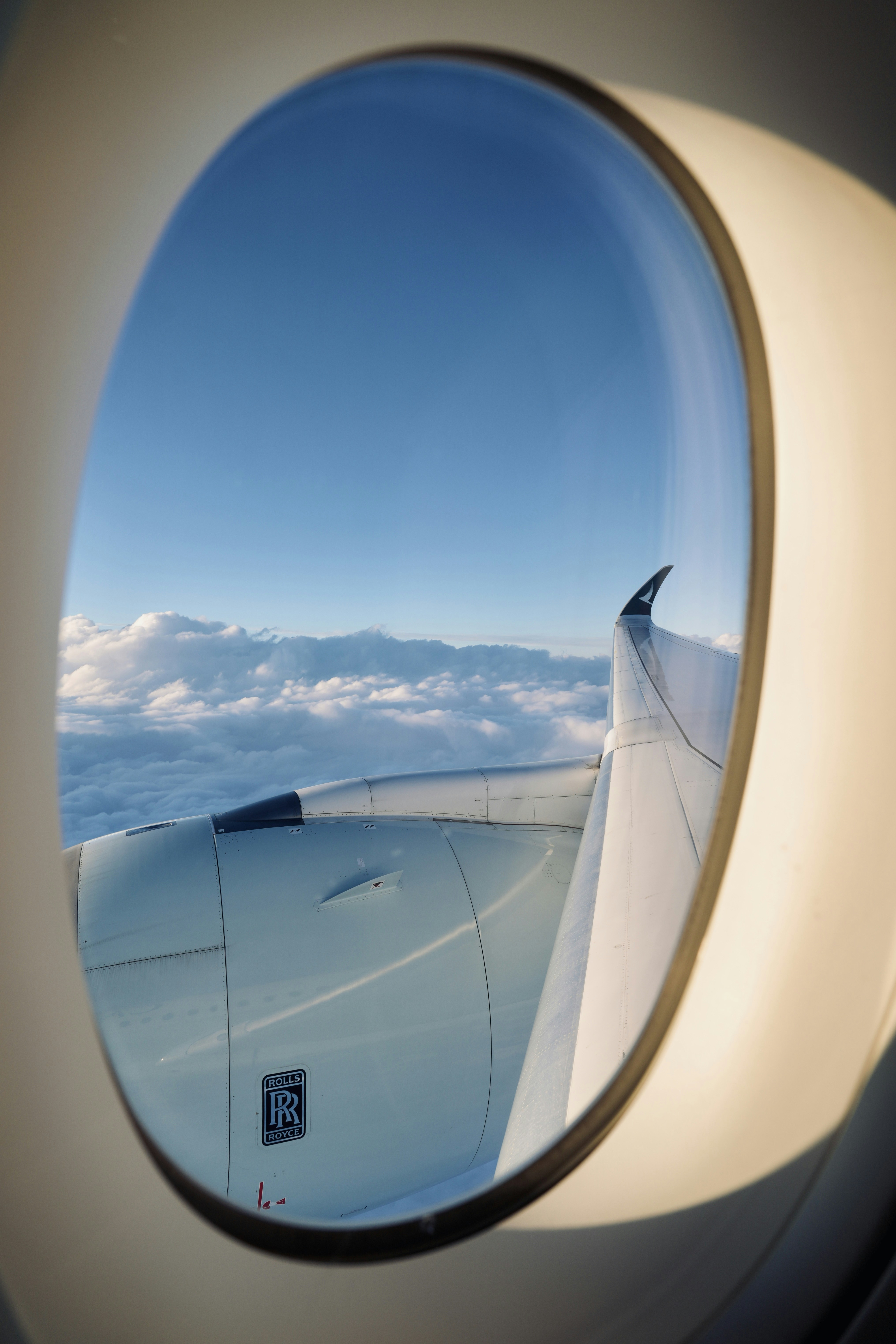 Window to the Sky: Ailettes and Clouds Past the Wing