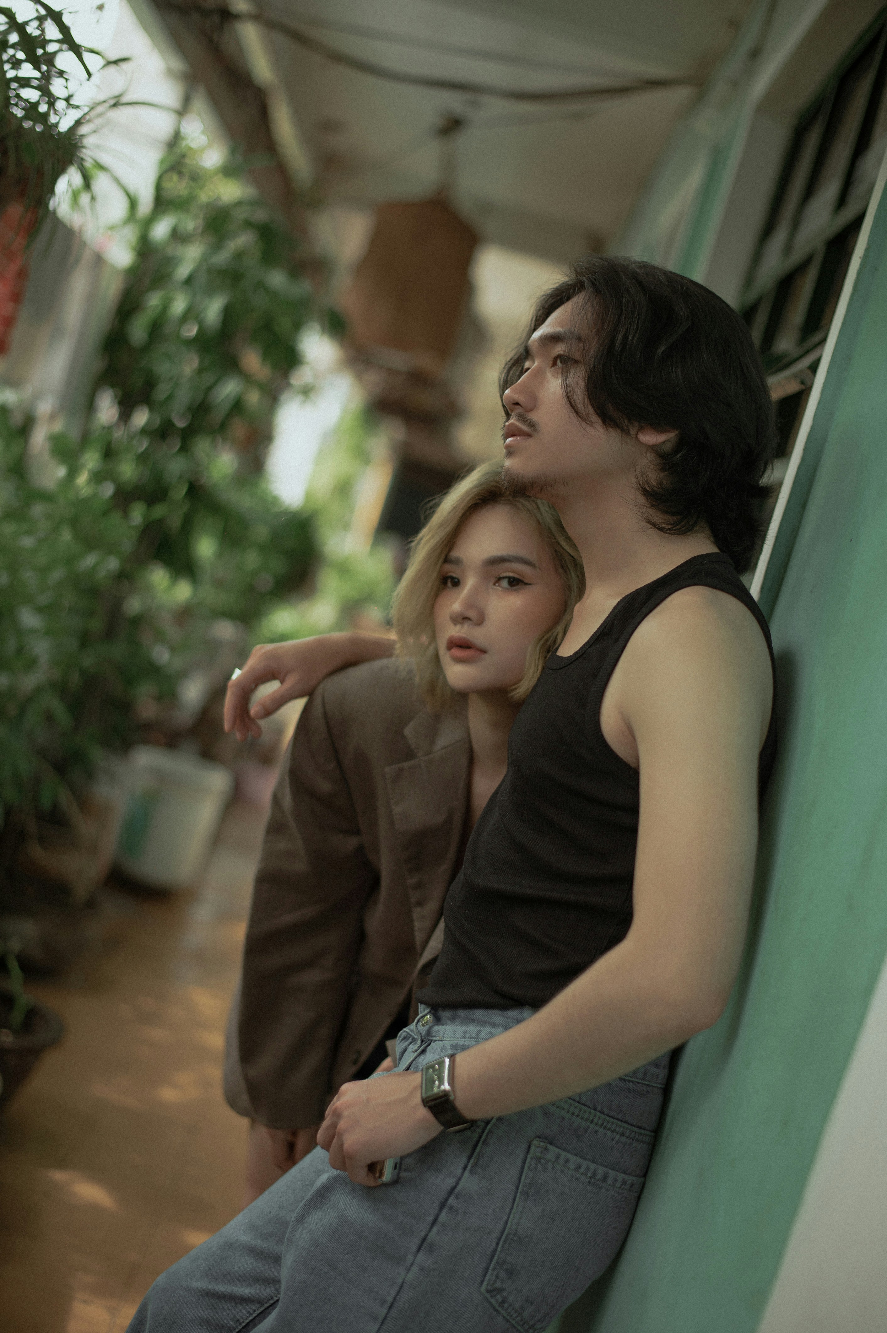 Two Friends in Soft Gaze on a Shaded Corridor