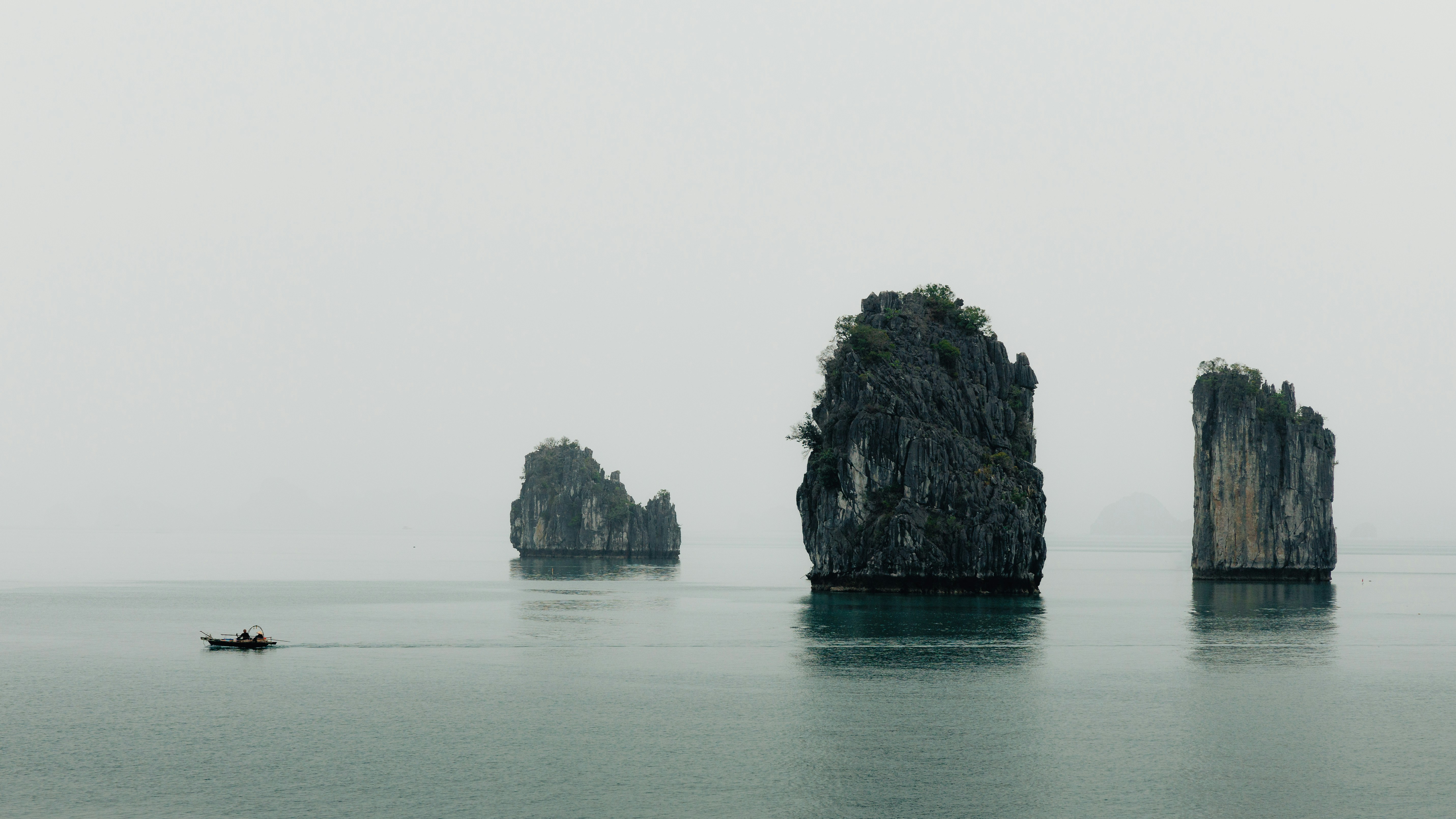 Isolated Sea Columns: Quiet Giants Beyond a Distant Boat
