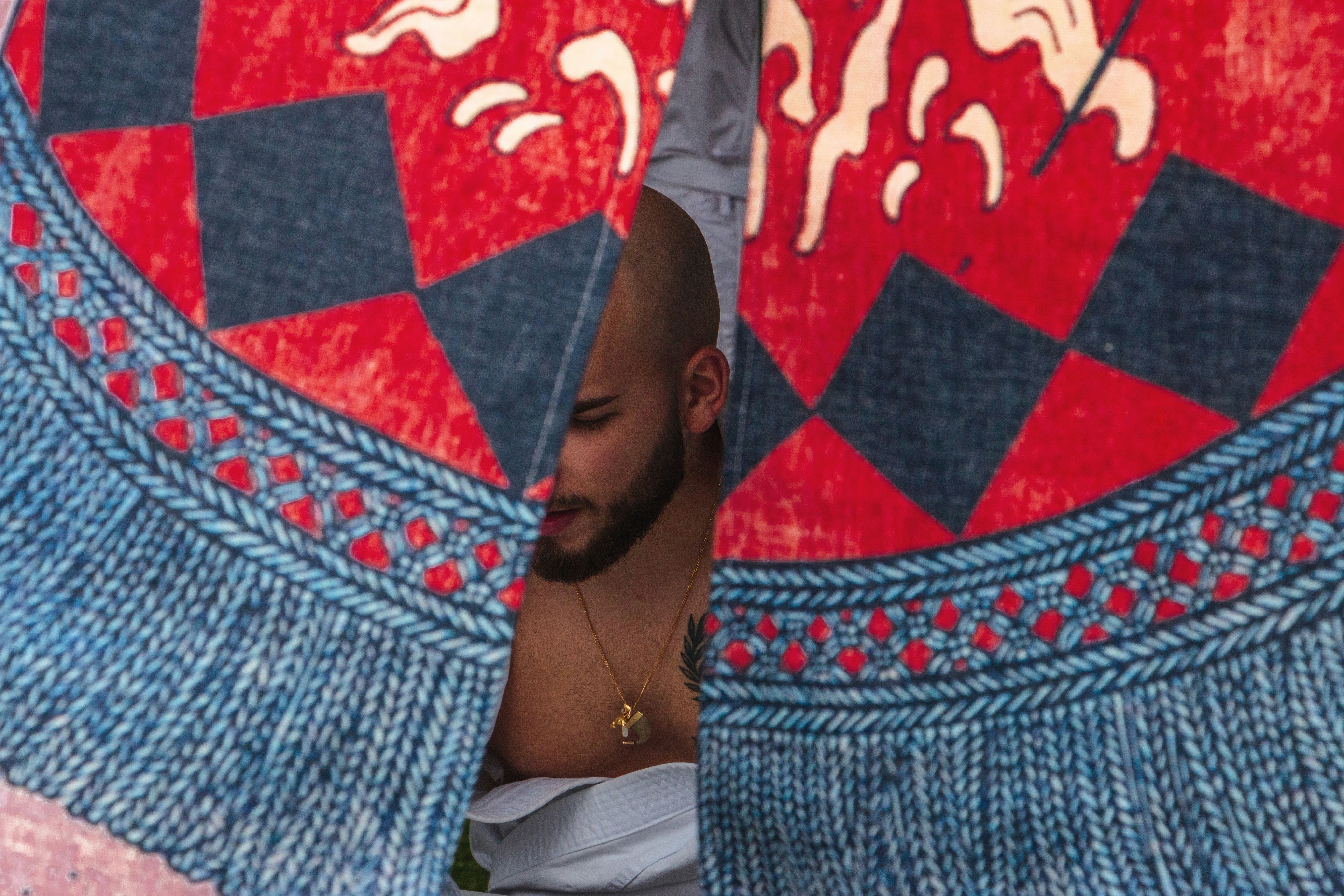 Hidden Portrait: A Quiet Face Peeking Between Textile Fringes