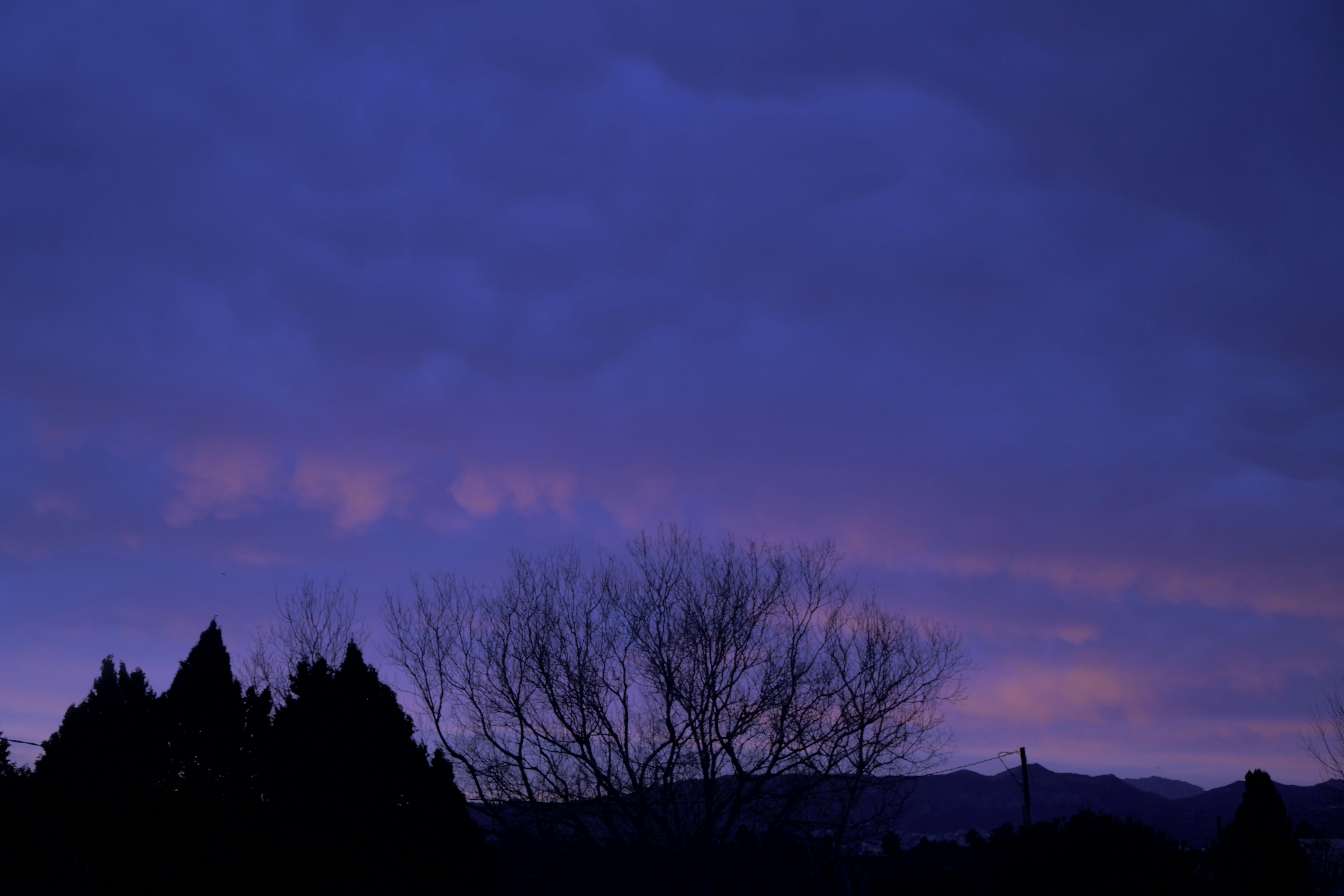 Dusk Over Bare Hills: A Quiet Horizon