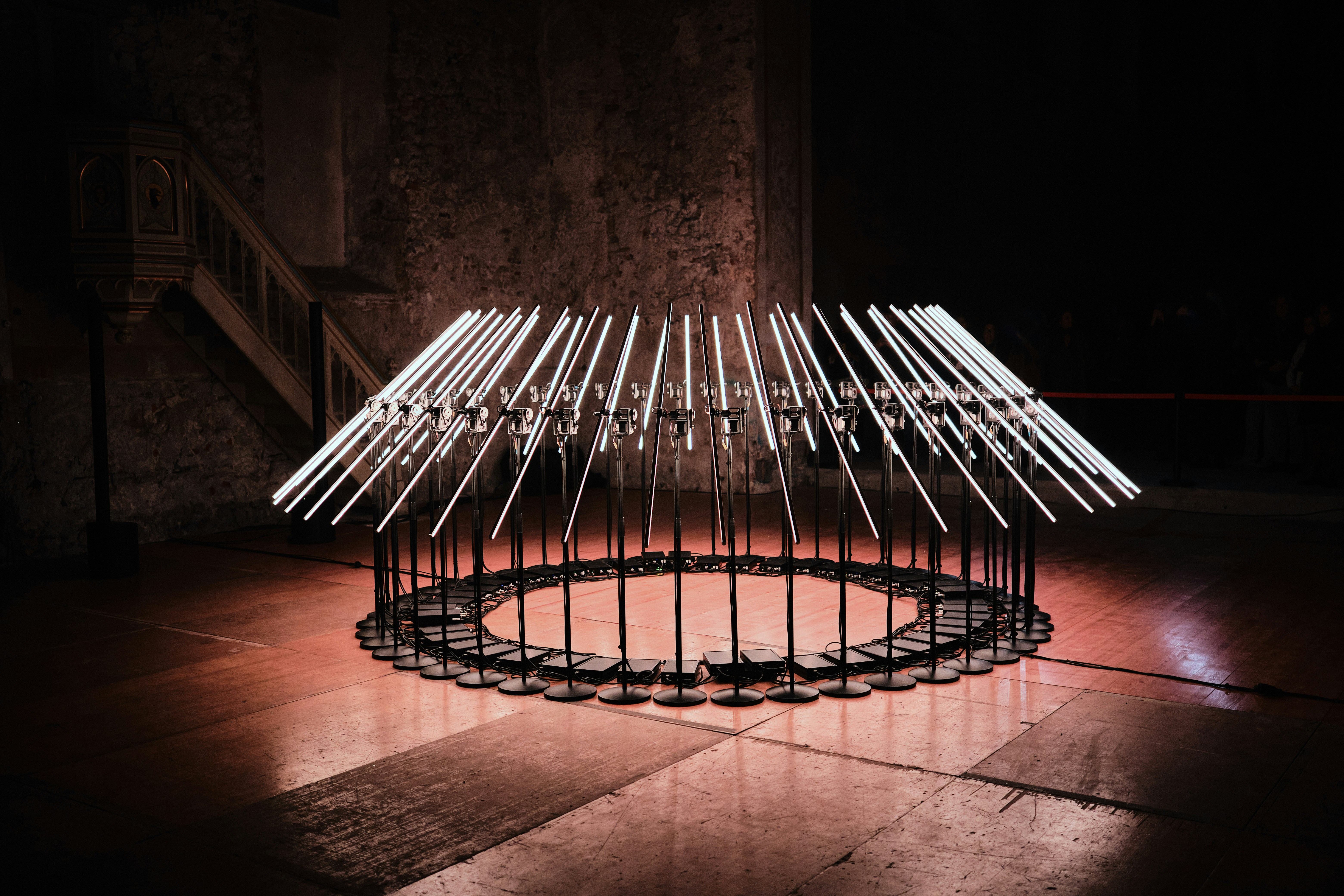 Illuminated Ring of Rods: A Halo of Light in a Dark Gallery