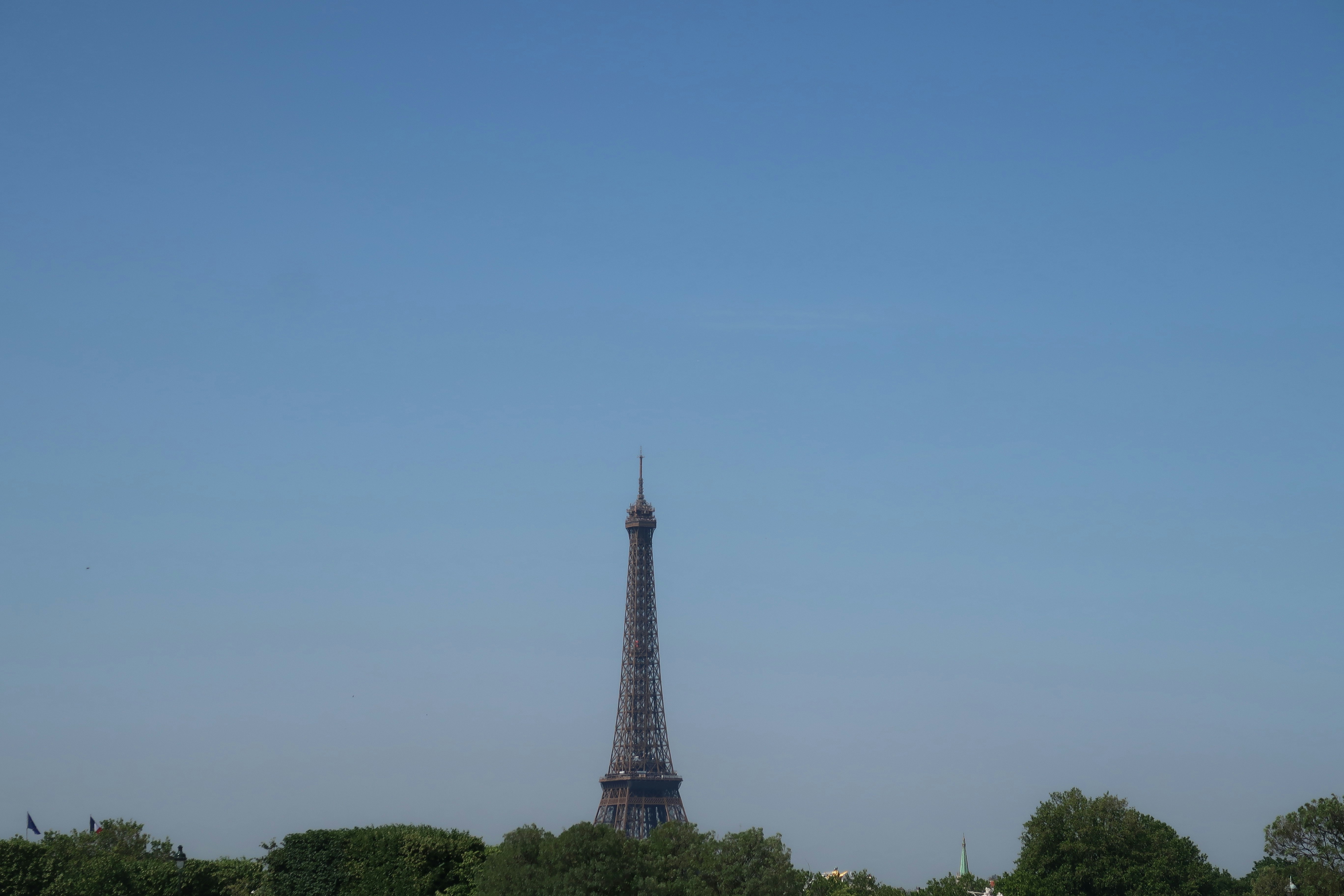 Towering Silhouette: Eiffel Edge Against a Clear Sky