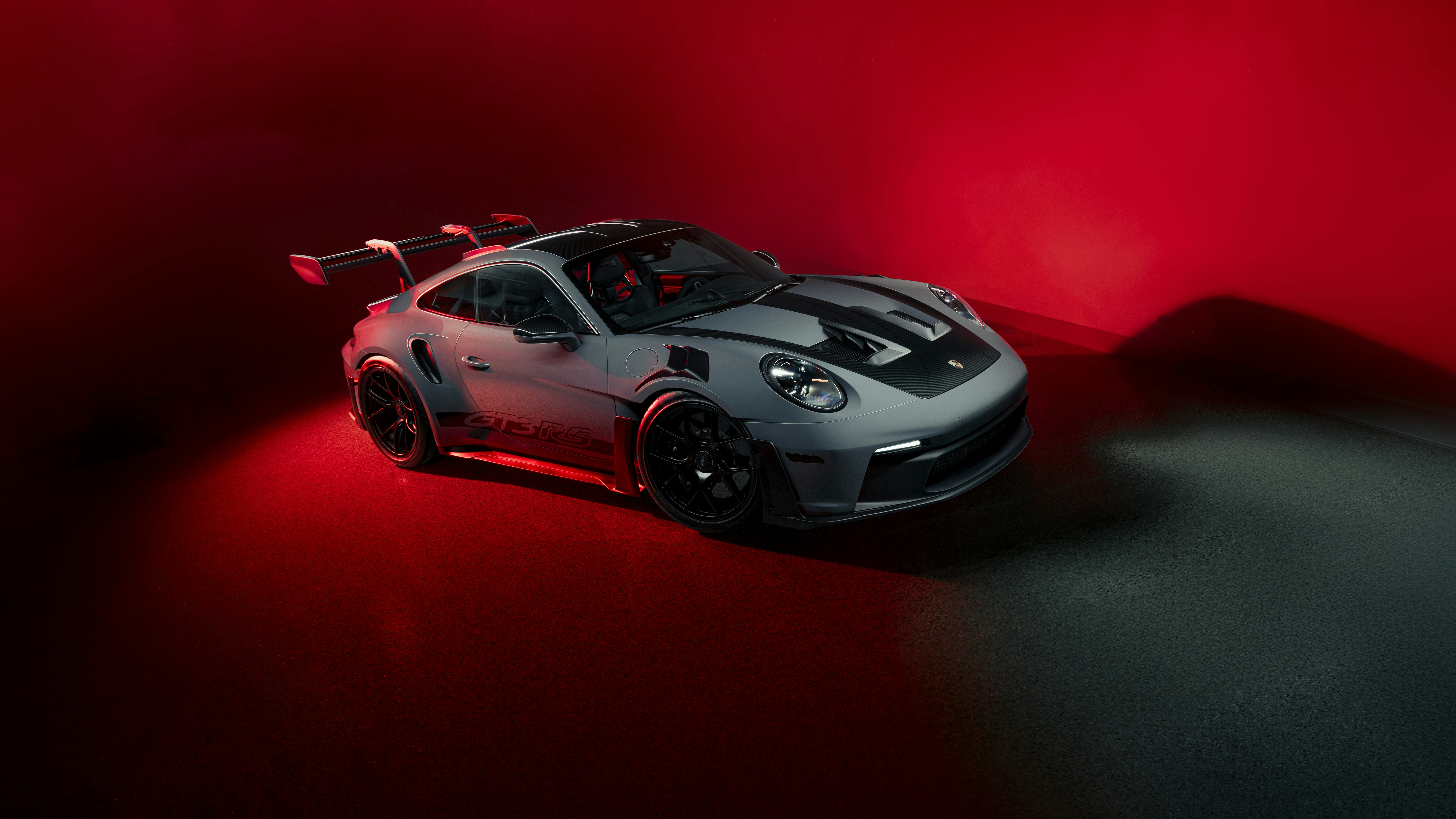 Midnight Speedster: A Porsche Surrounded by Red Nebula Shadows