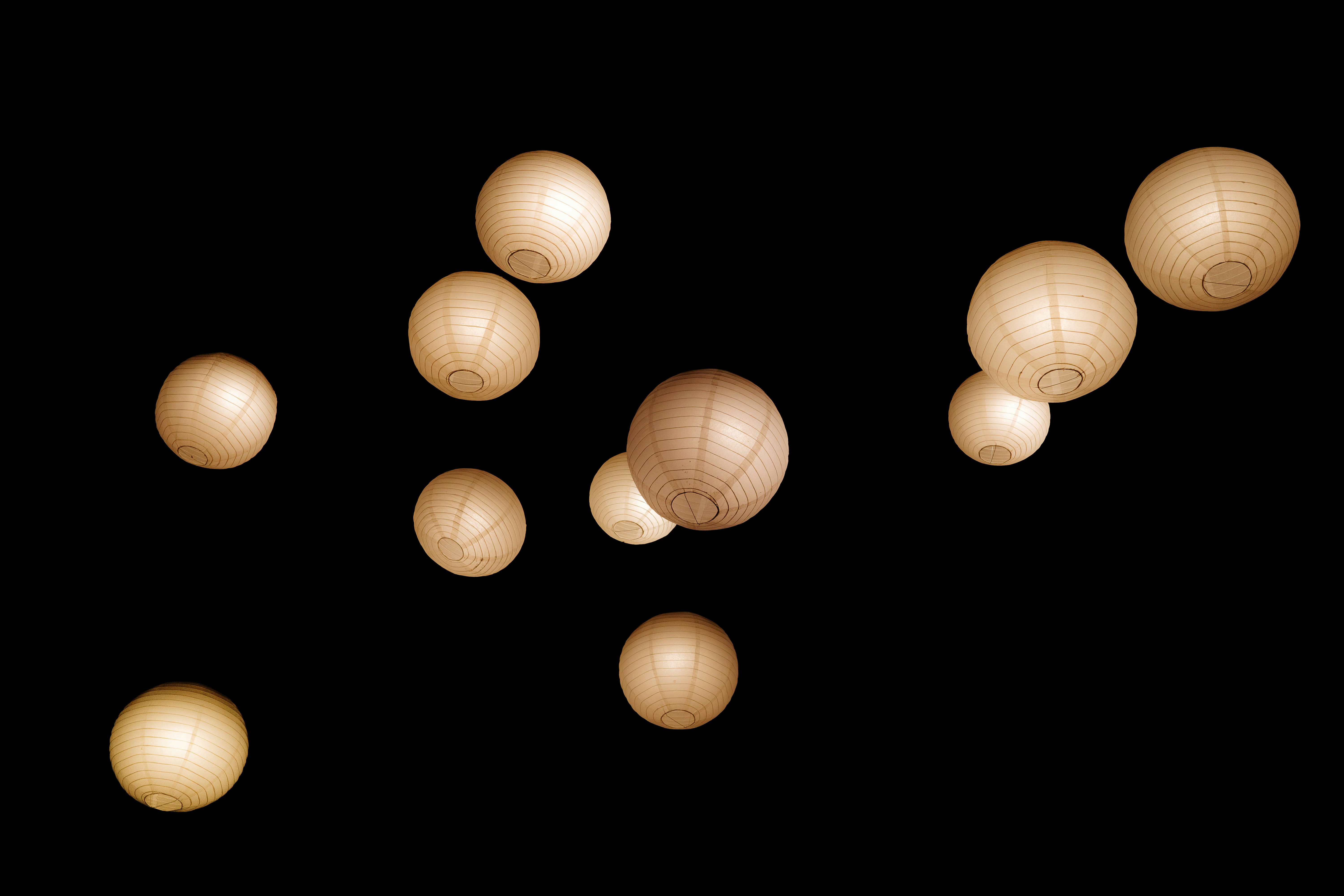 Floating Orbs: Night Market Lanterns Against Velvet Black