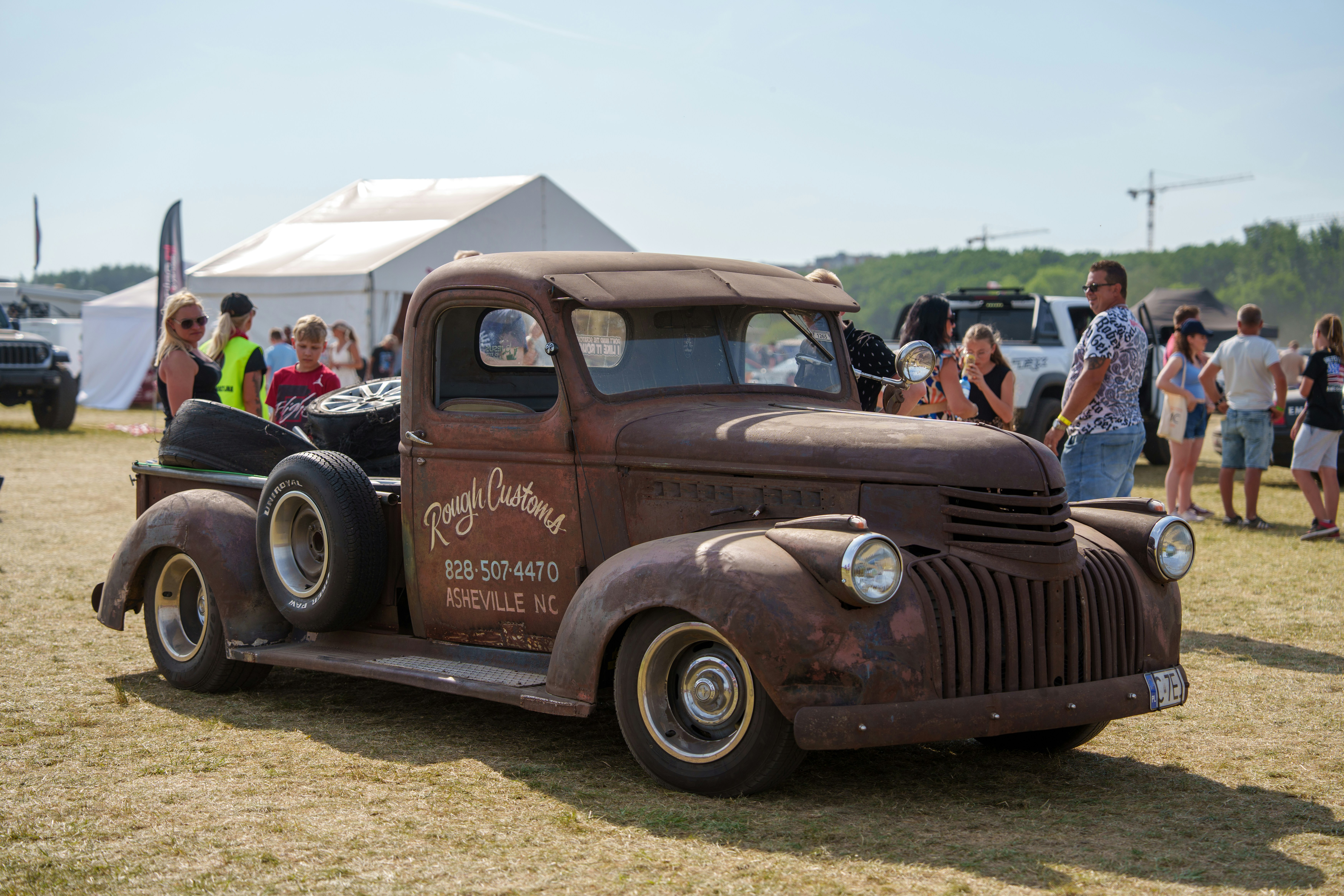 Rusty Showmaster: A Vintage Truck Reigns at the Car Meet