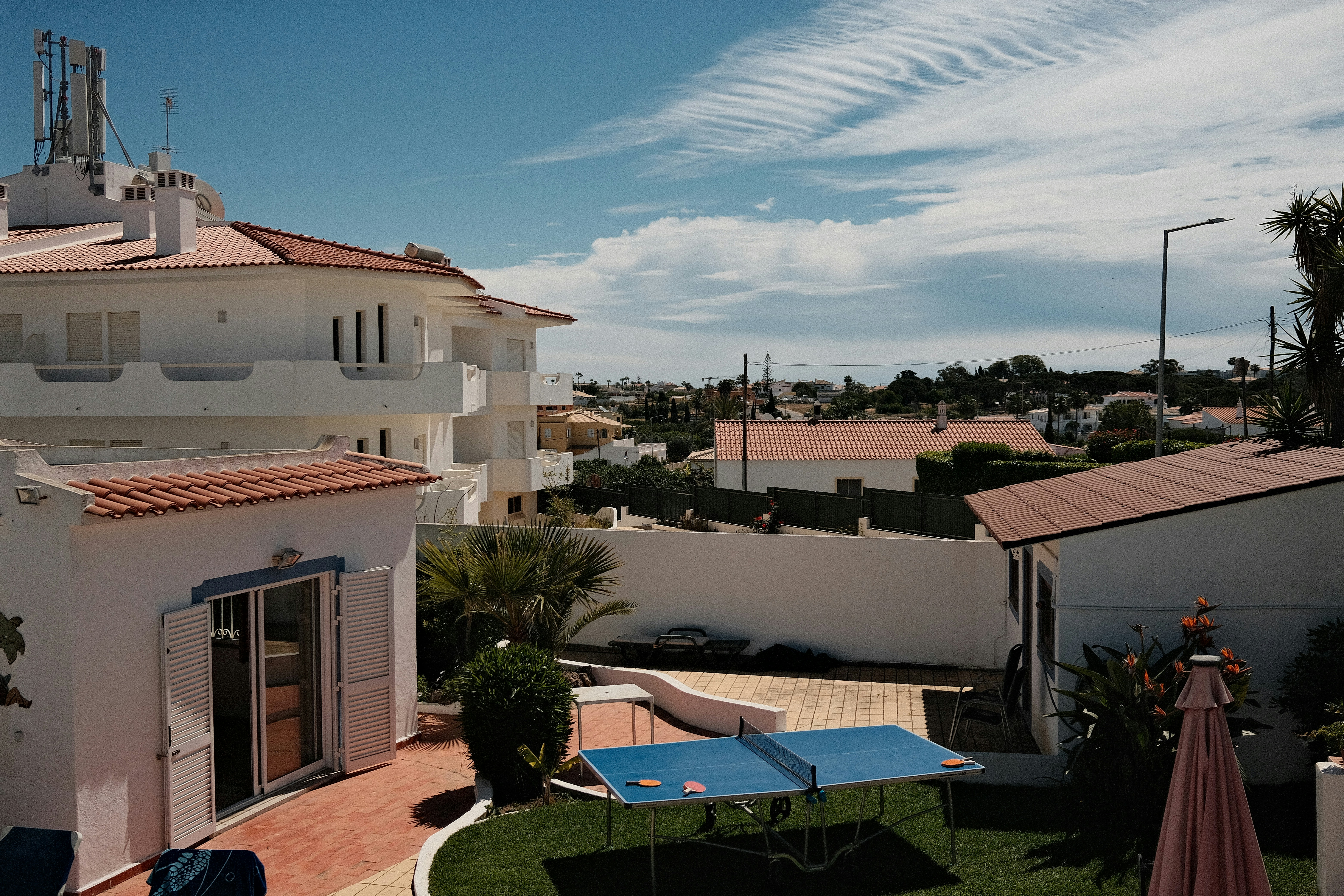Sunlit Mediterranean Terrace Overlooking a Coastal Town