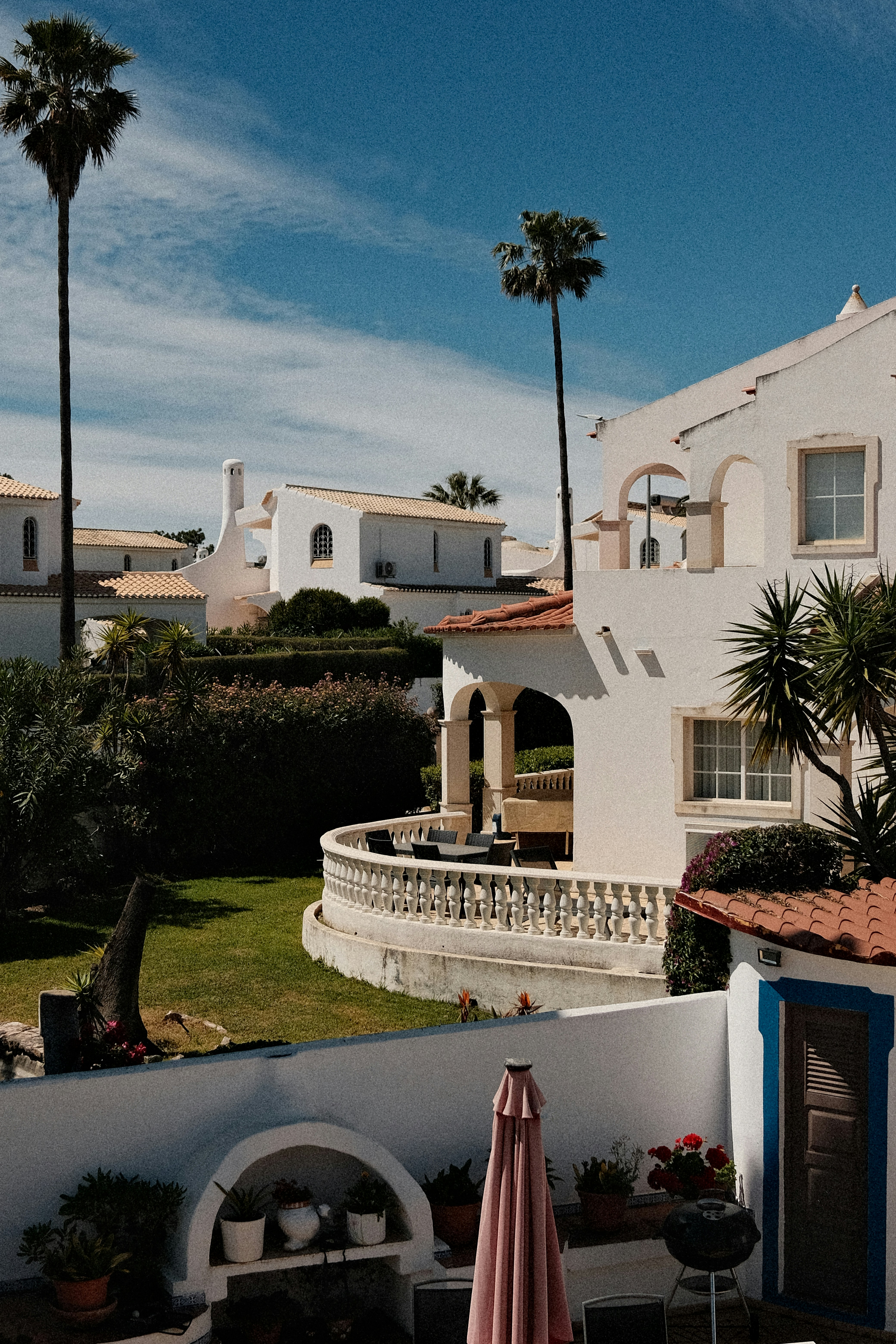 Coastal Villa Rows Under Palm Shade