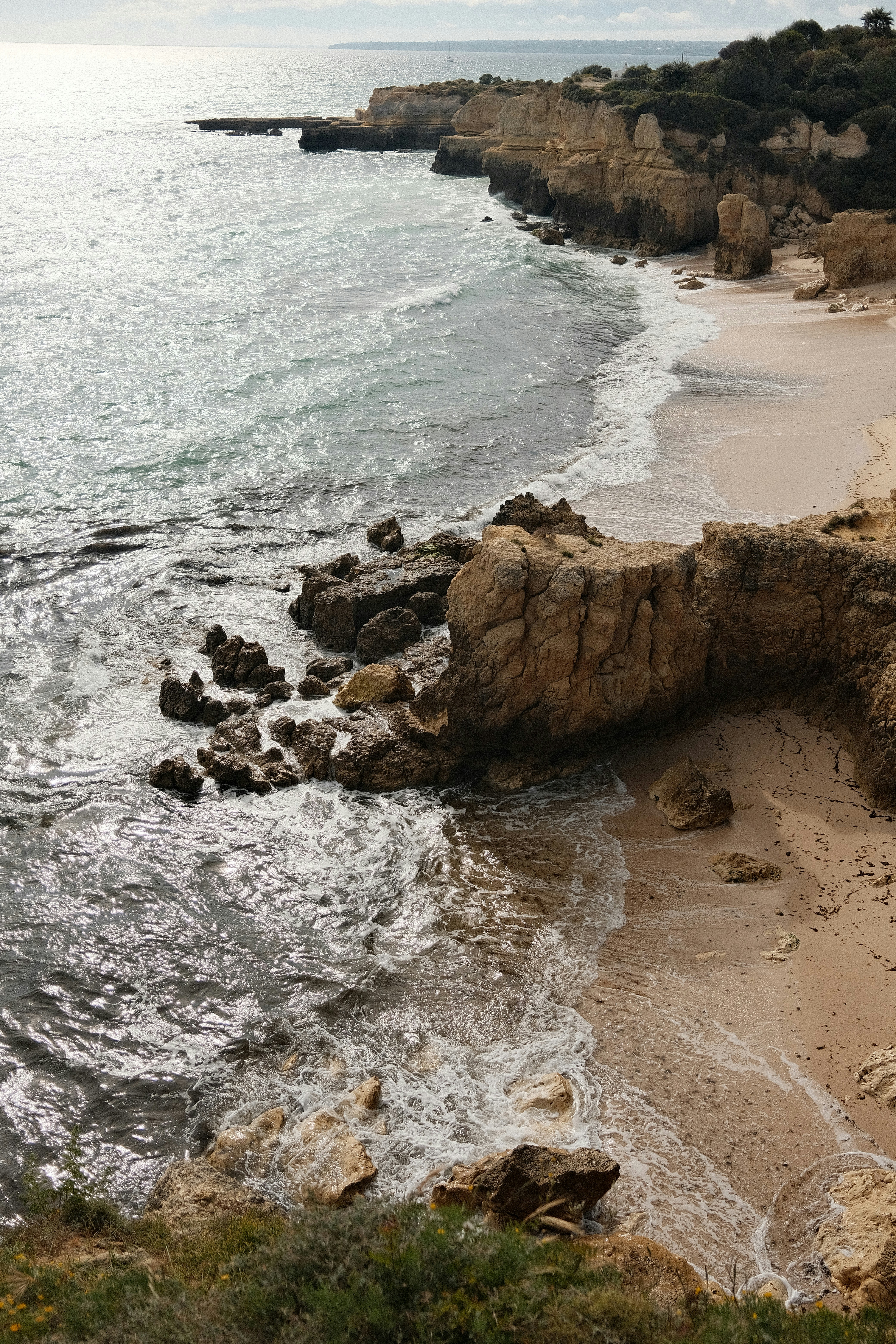 Cliffside Cove: Sunlit Rocks and Quiet Waves