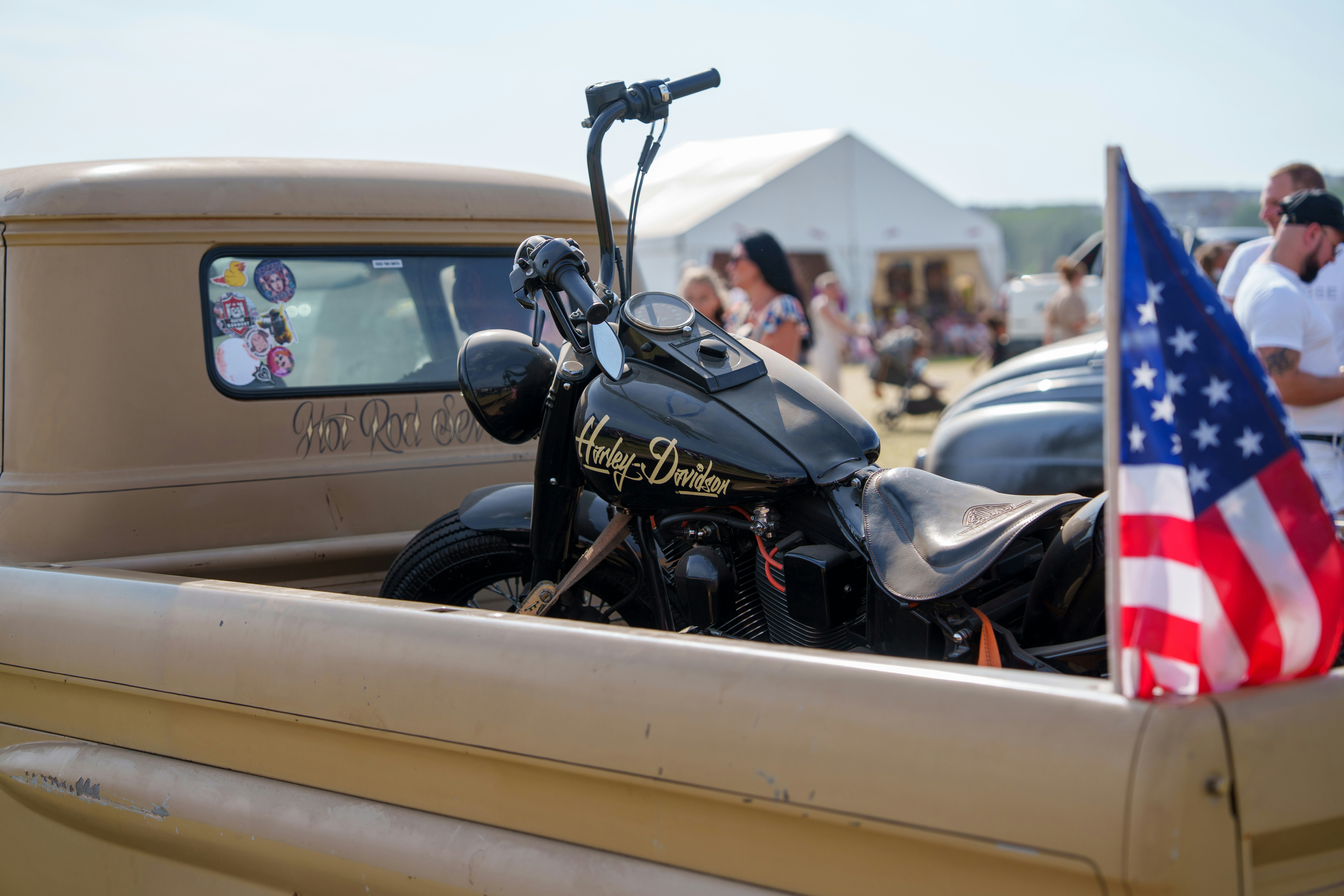 Harley at the Rally: A Vintage Bike Curated in a Classic Truck Bed