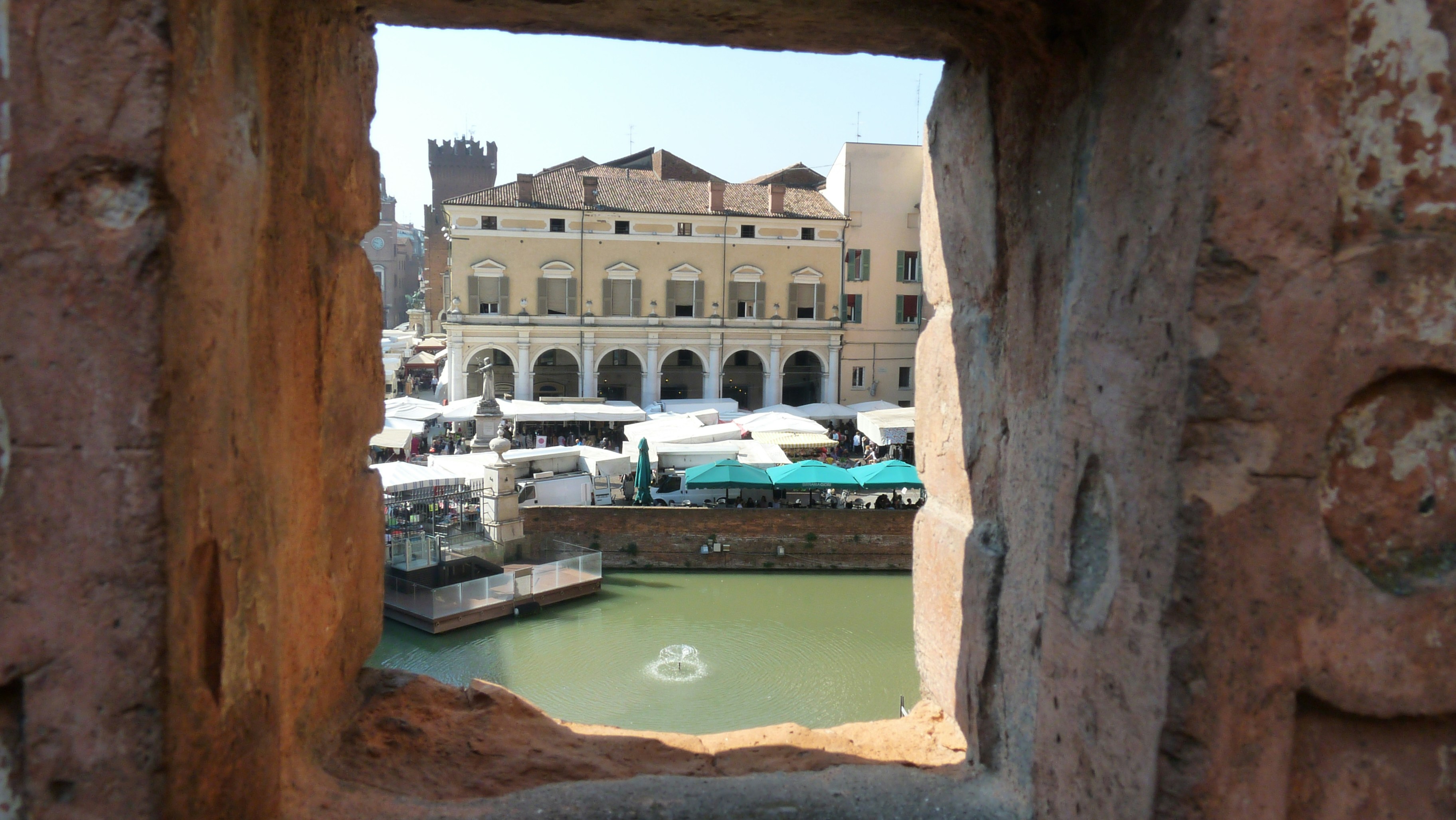 Window to the Piazza: a sunlit harbor of history framed by ancient stone