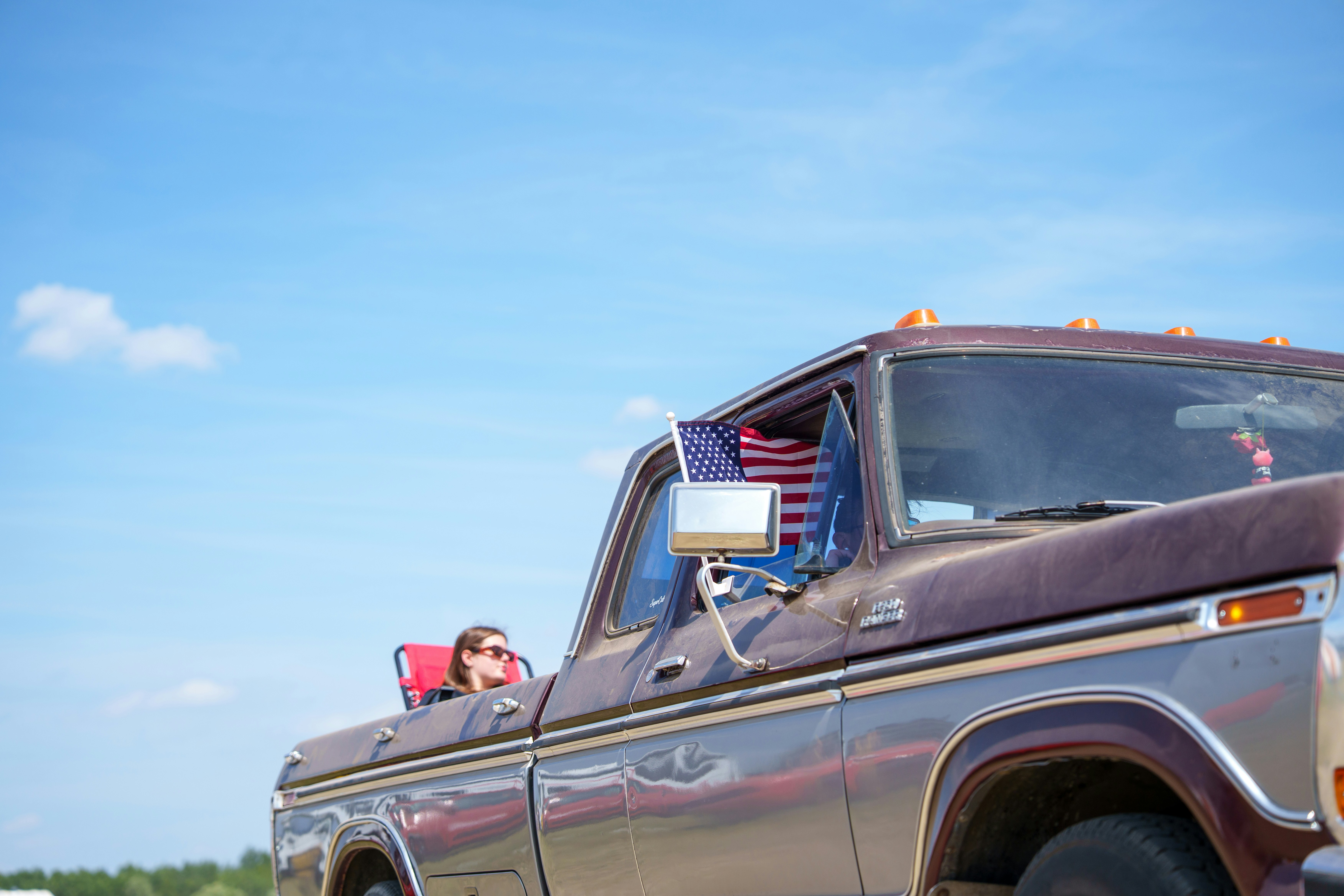 Flagged Ride: A Far-Right View from a Classic Pickup Window