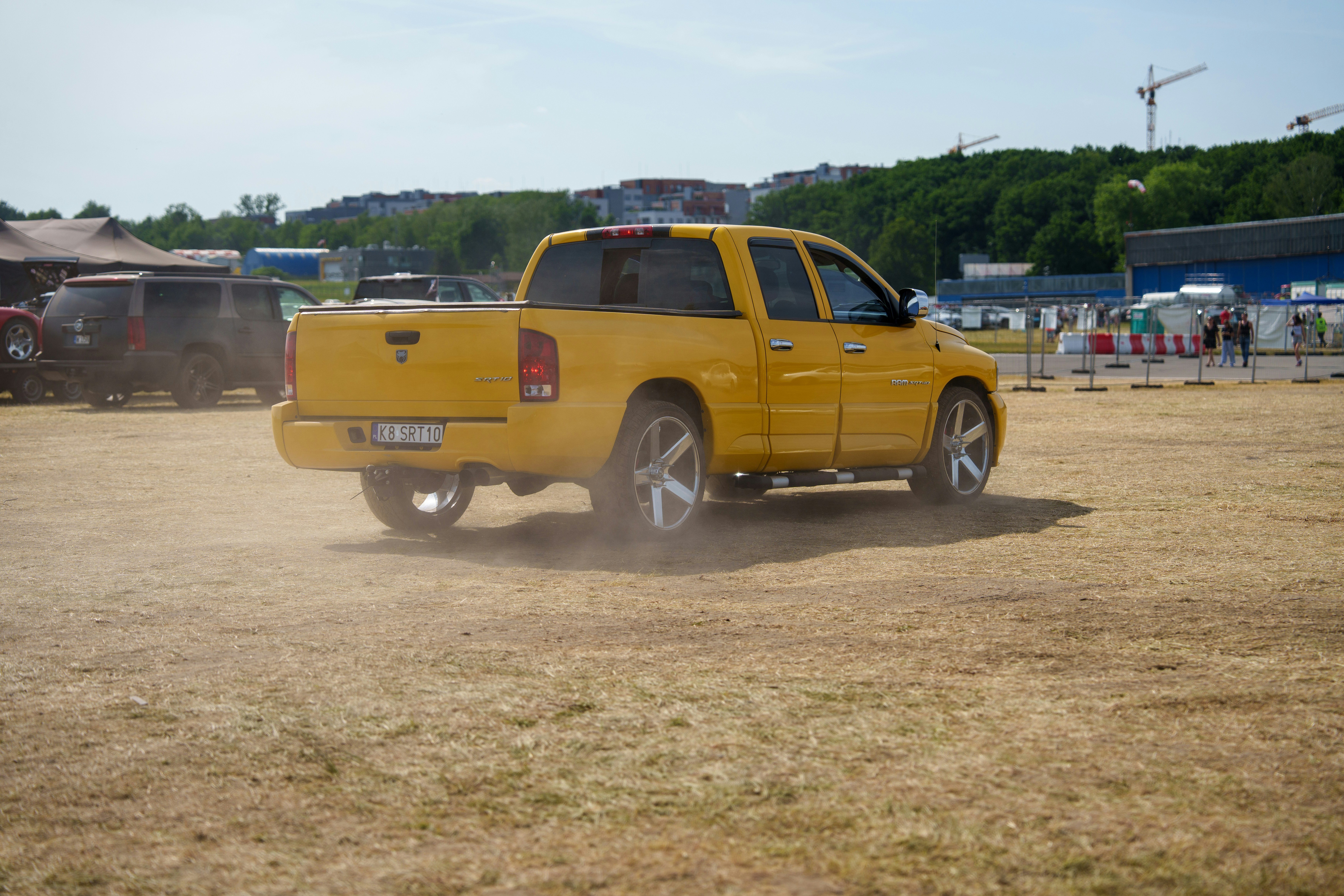 Dust Trail and Yellow Pickup: A Midfield Chase in an Open Field