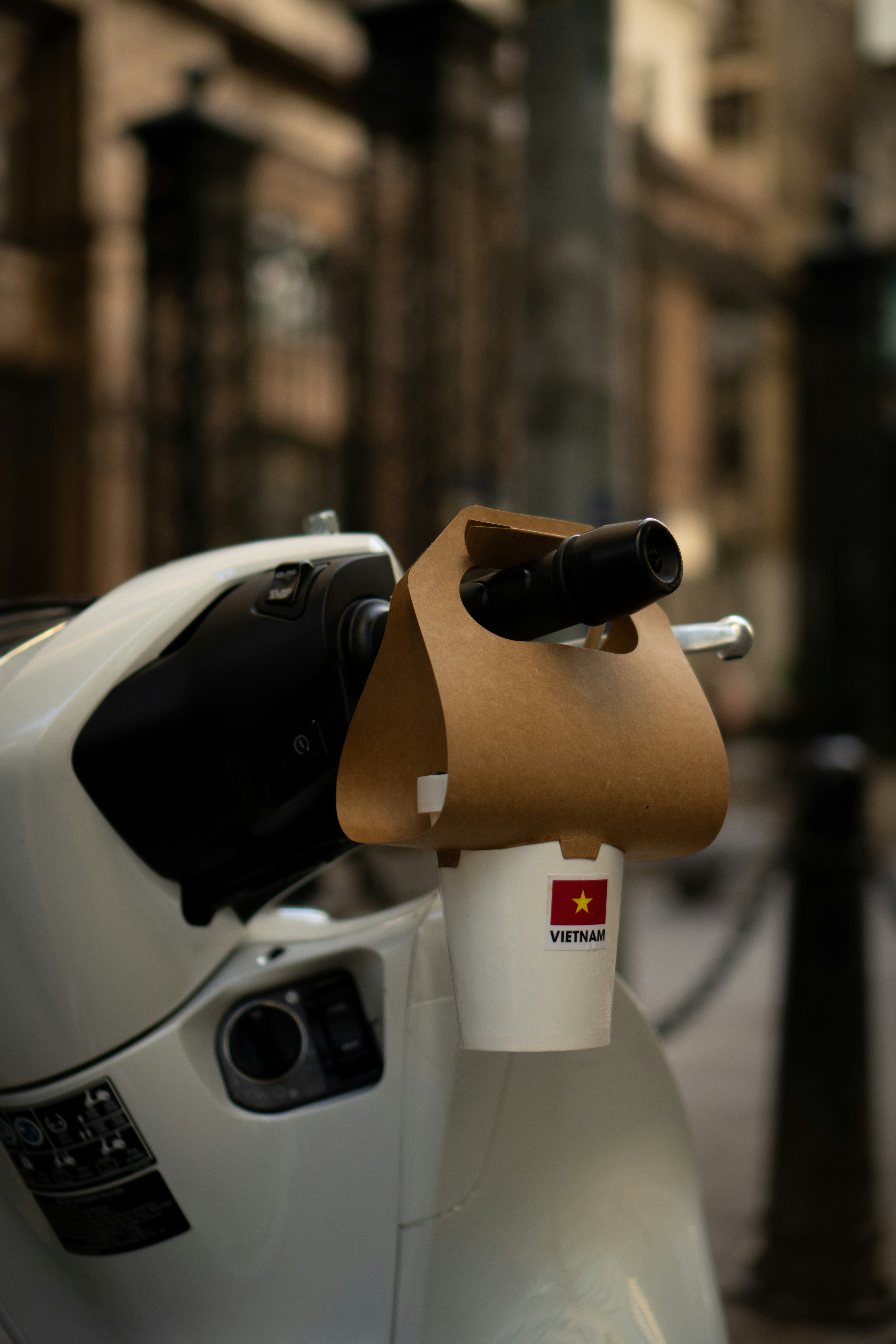 Vignette of a tagged Vespa: Paper bag and cup as a tactile signature