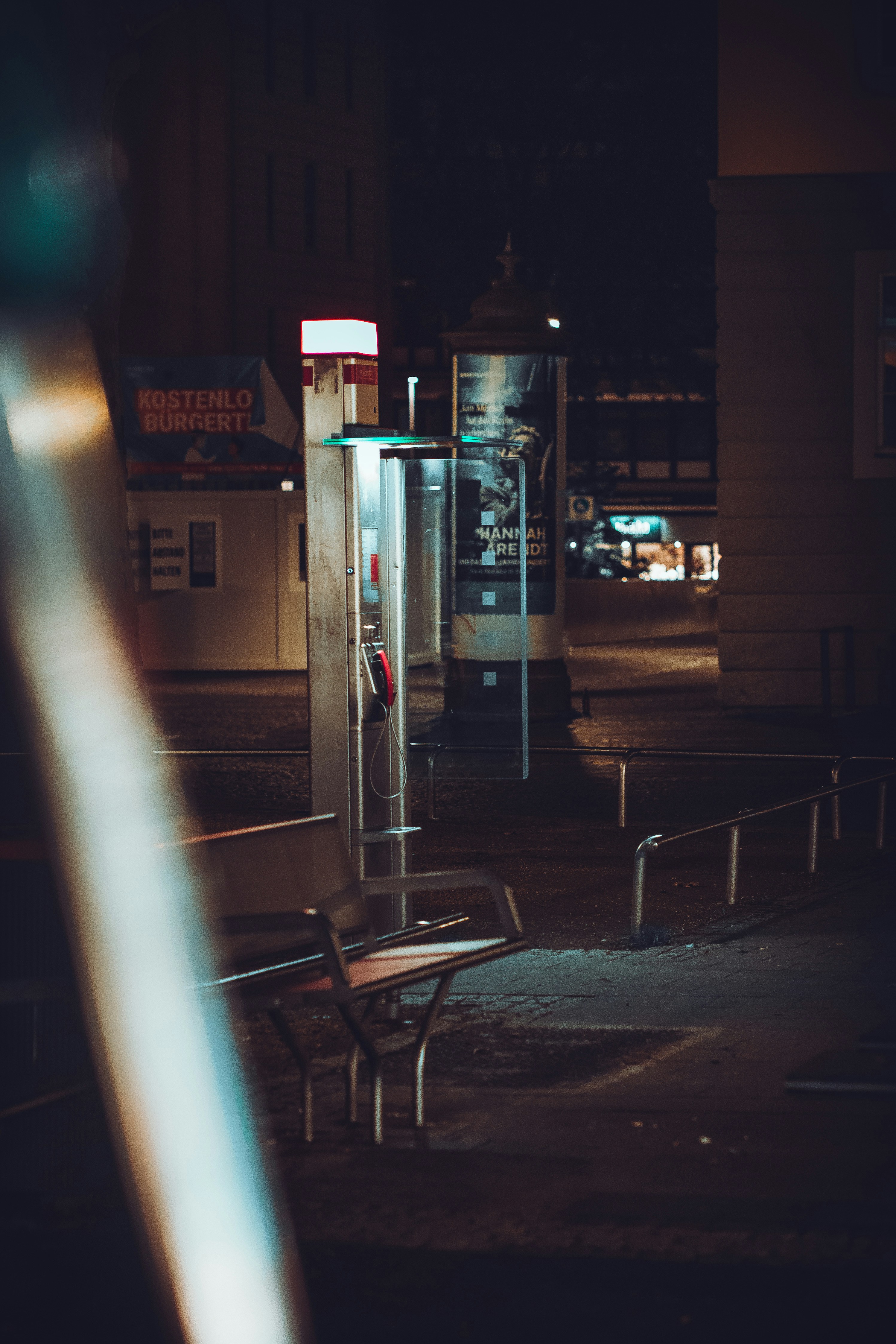 Neon Lines and Quiet Pause in a Night Street