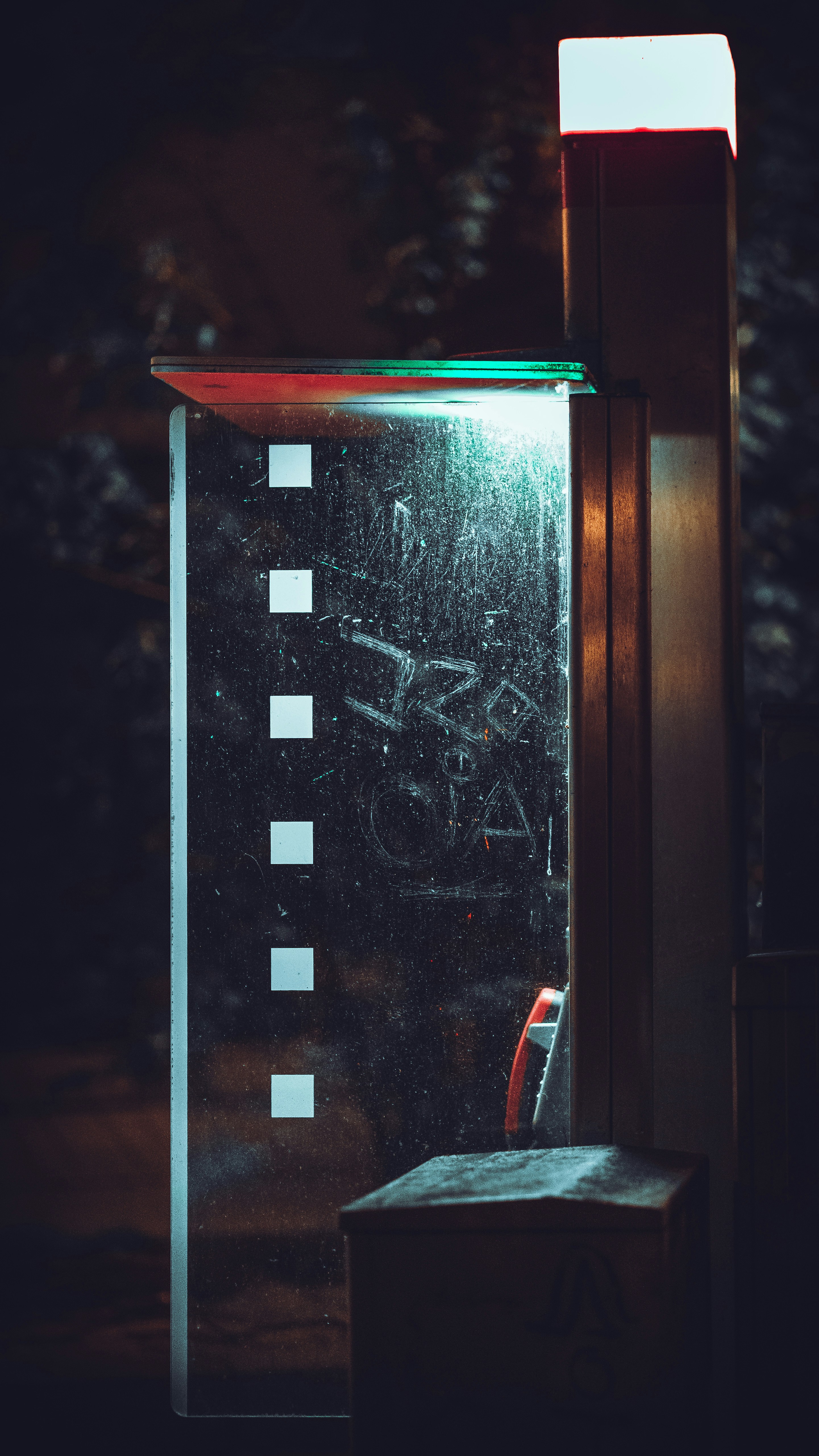 Neon-Glinted Booth at Night