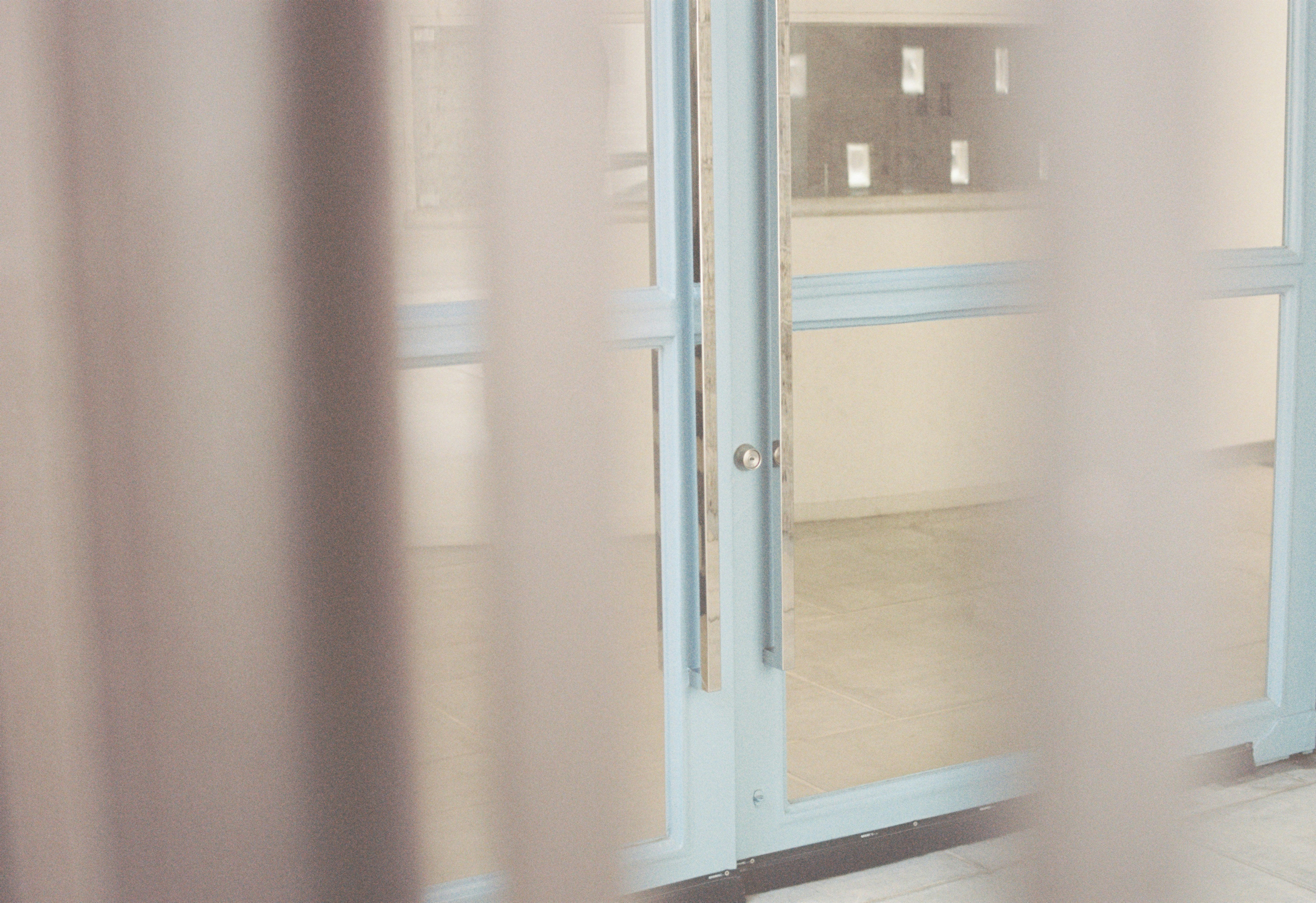 Soft doorway glow through frosted glass panels