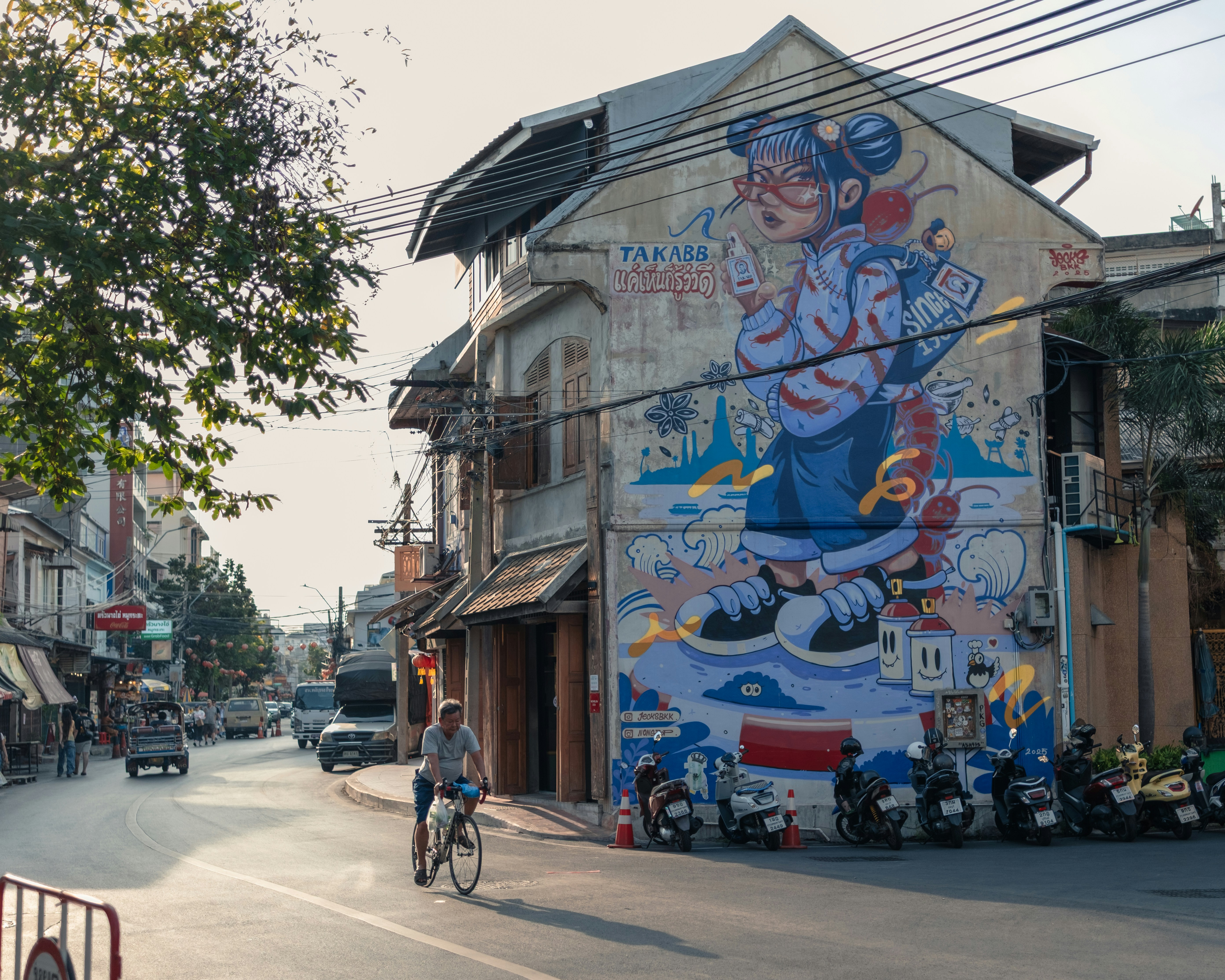 Mural, Motorbike, and Morning Street: A Quiet Urban Corridor