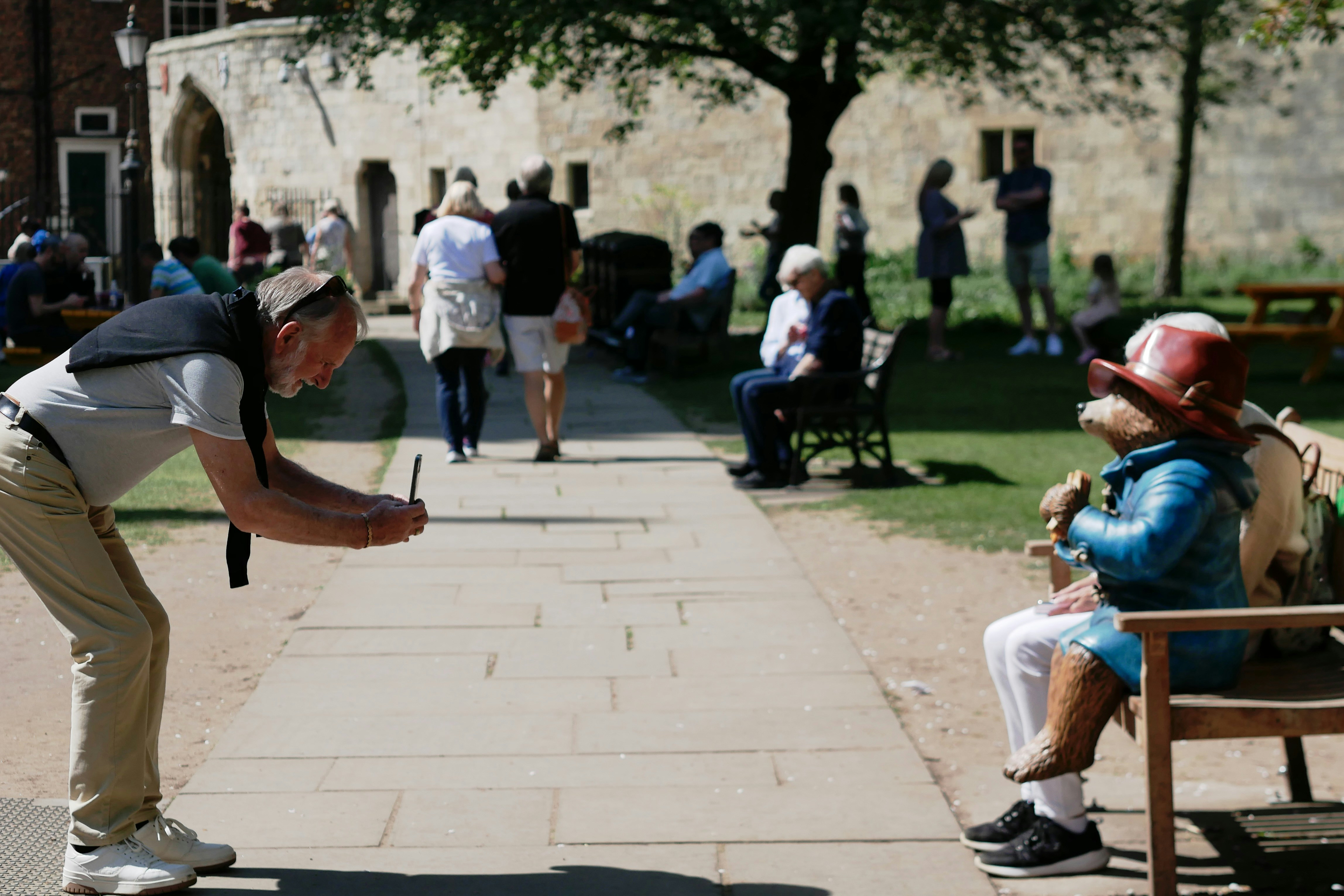 Hands in Focus: A Street Photographer Captures a Moment by the Parked Bench