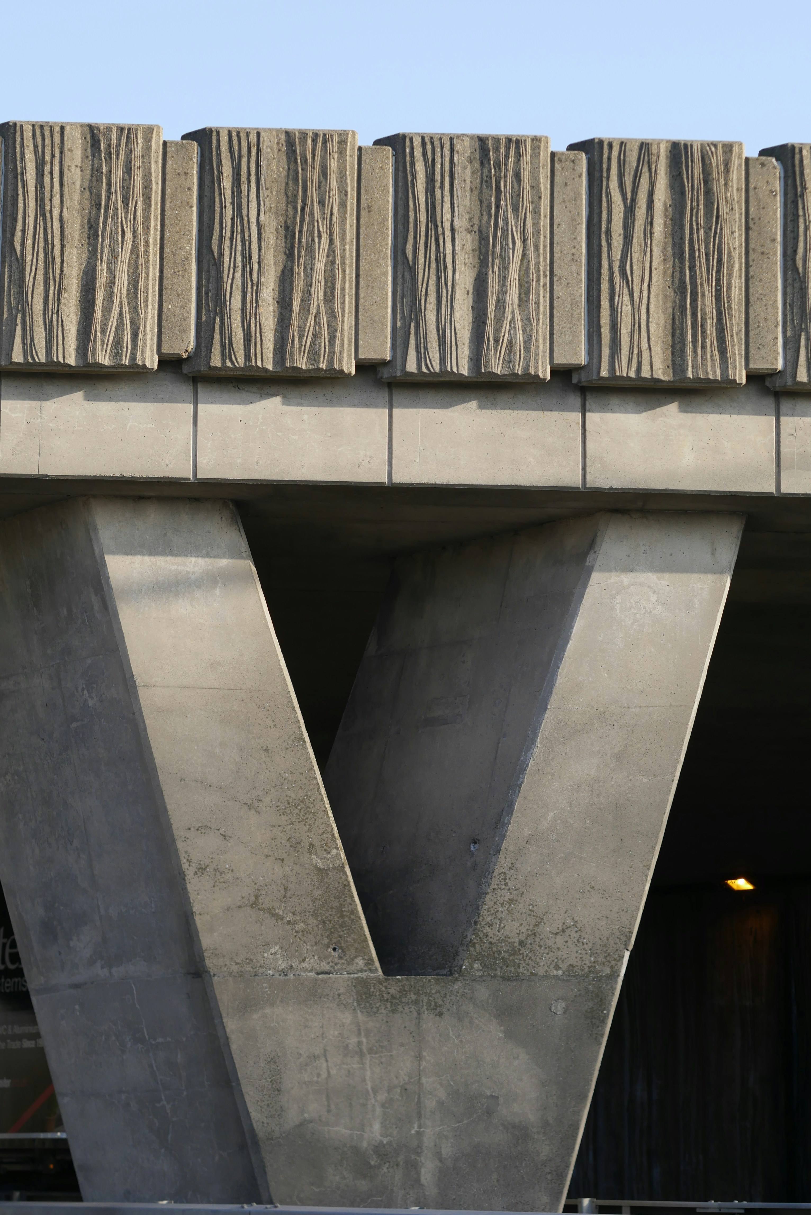Concrete bridge supports with textured railing detail