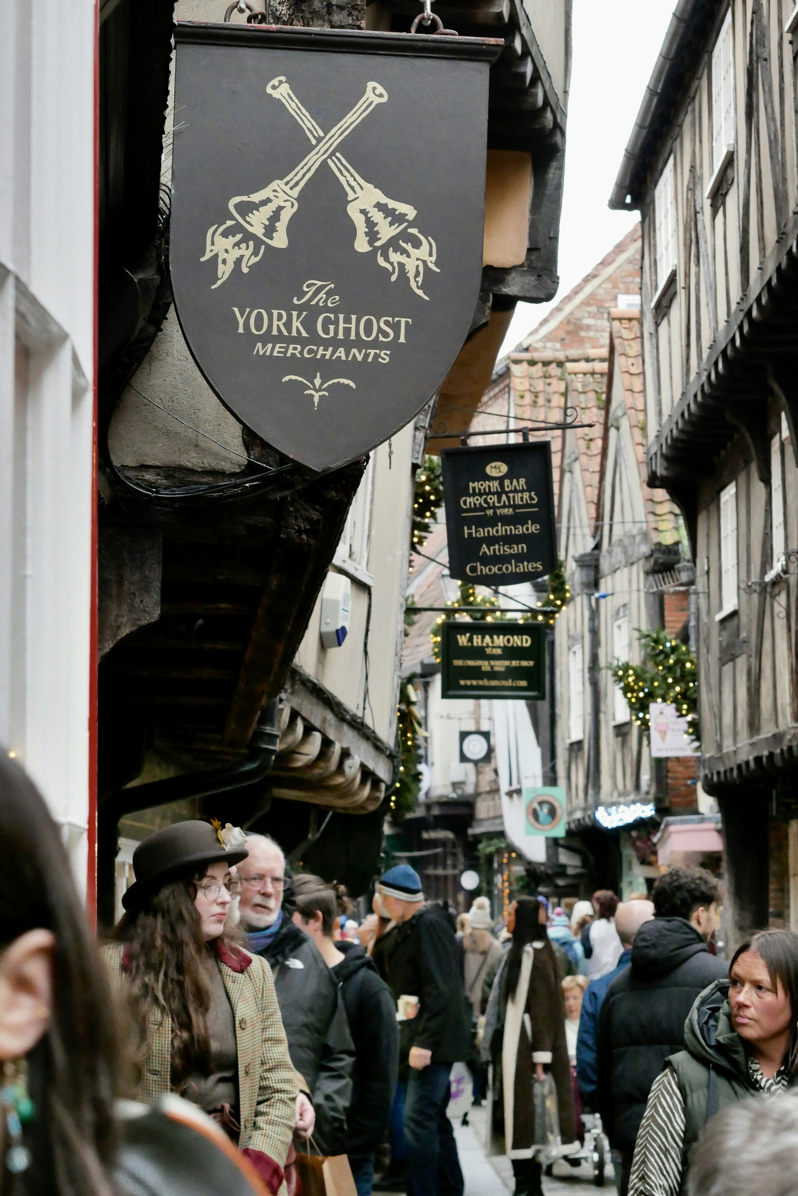 Gothic Lanterns over a Bustling York Lane