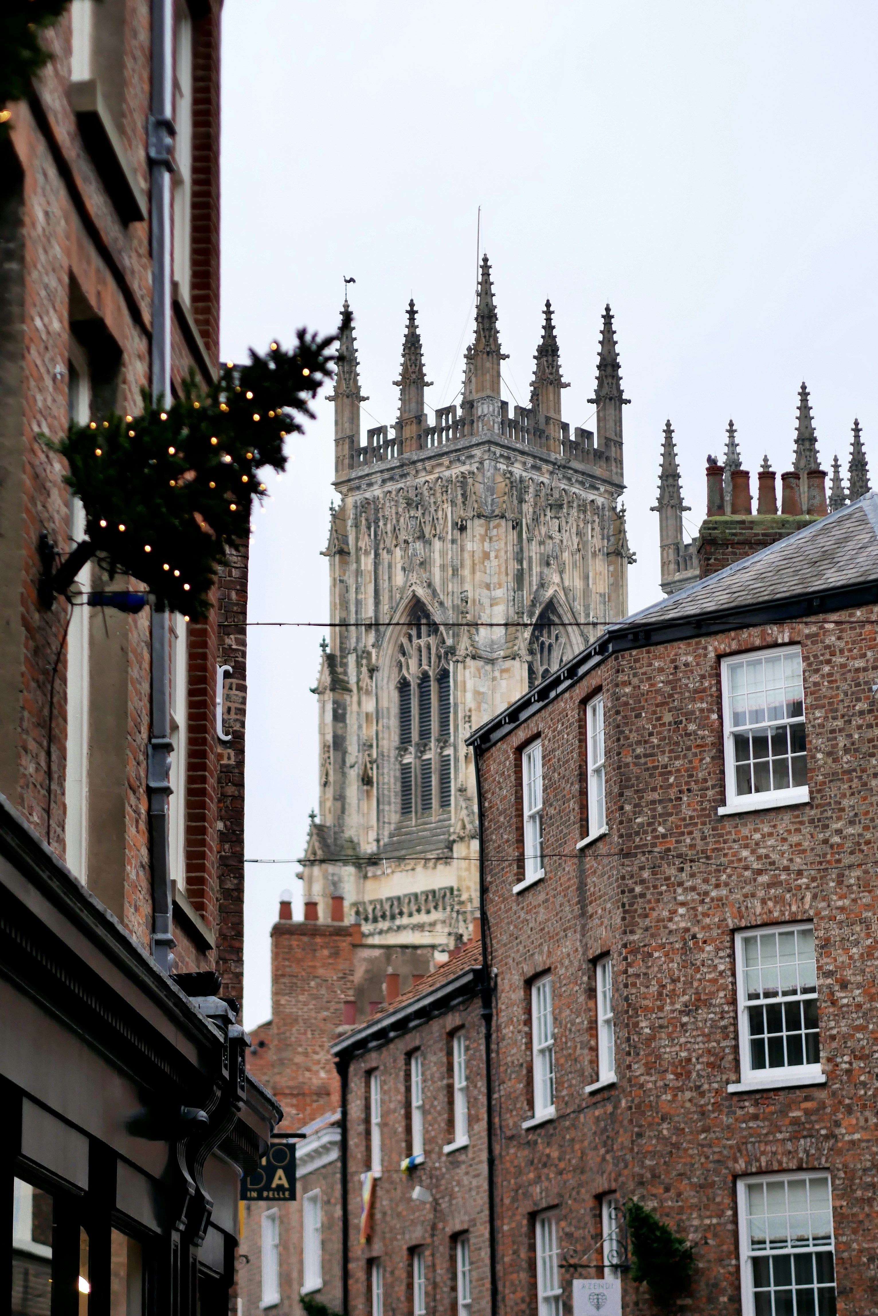 St. Mary’s towers peeking over a brick-lined alley