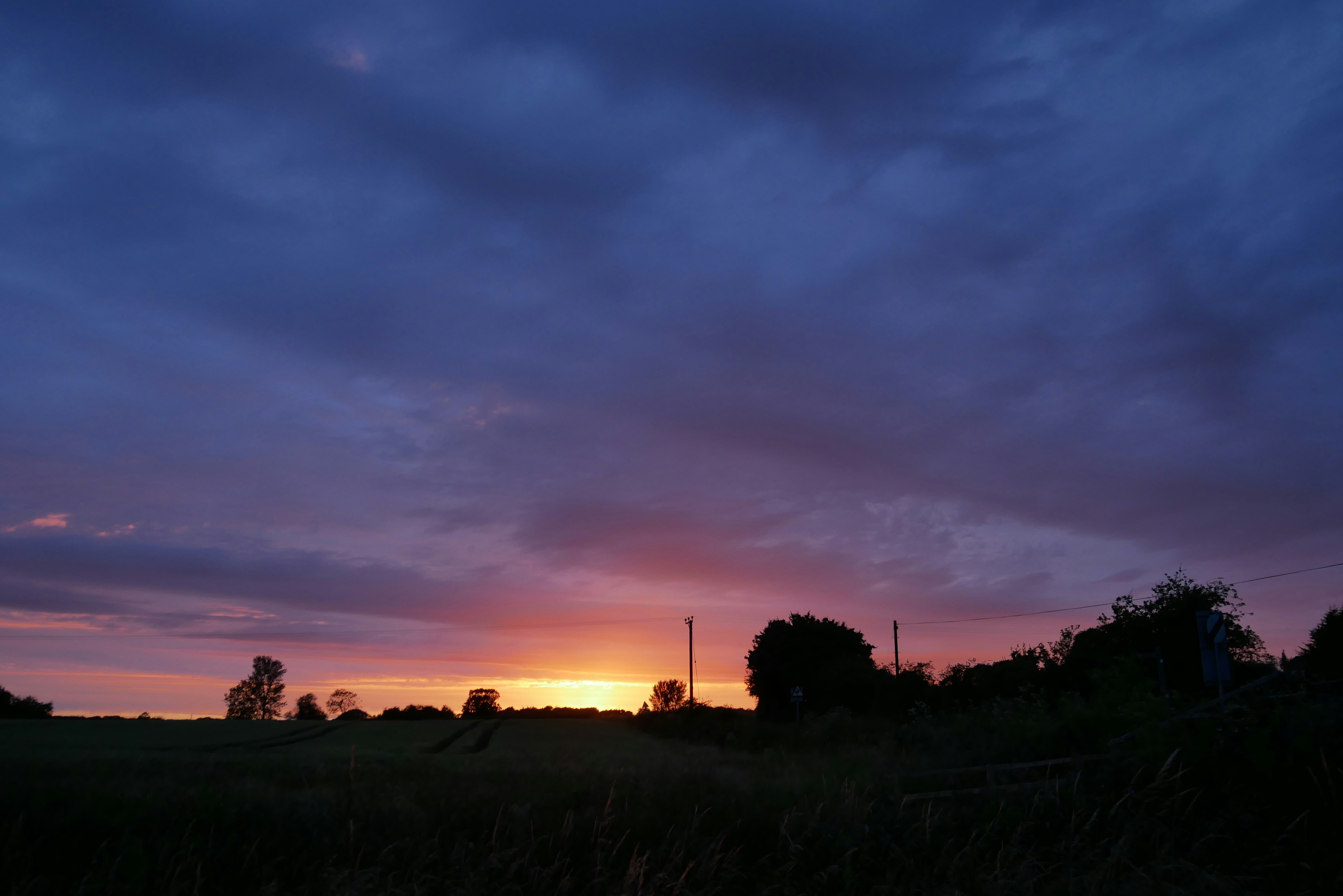 Horizon Kissed by Sunset: Quiet Fields at Dusk