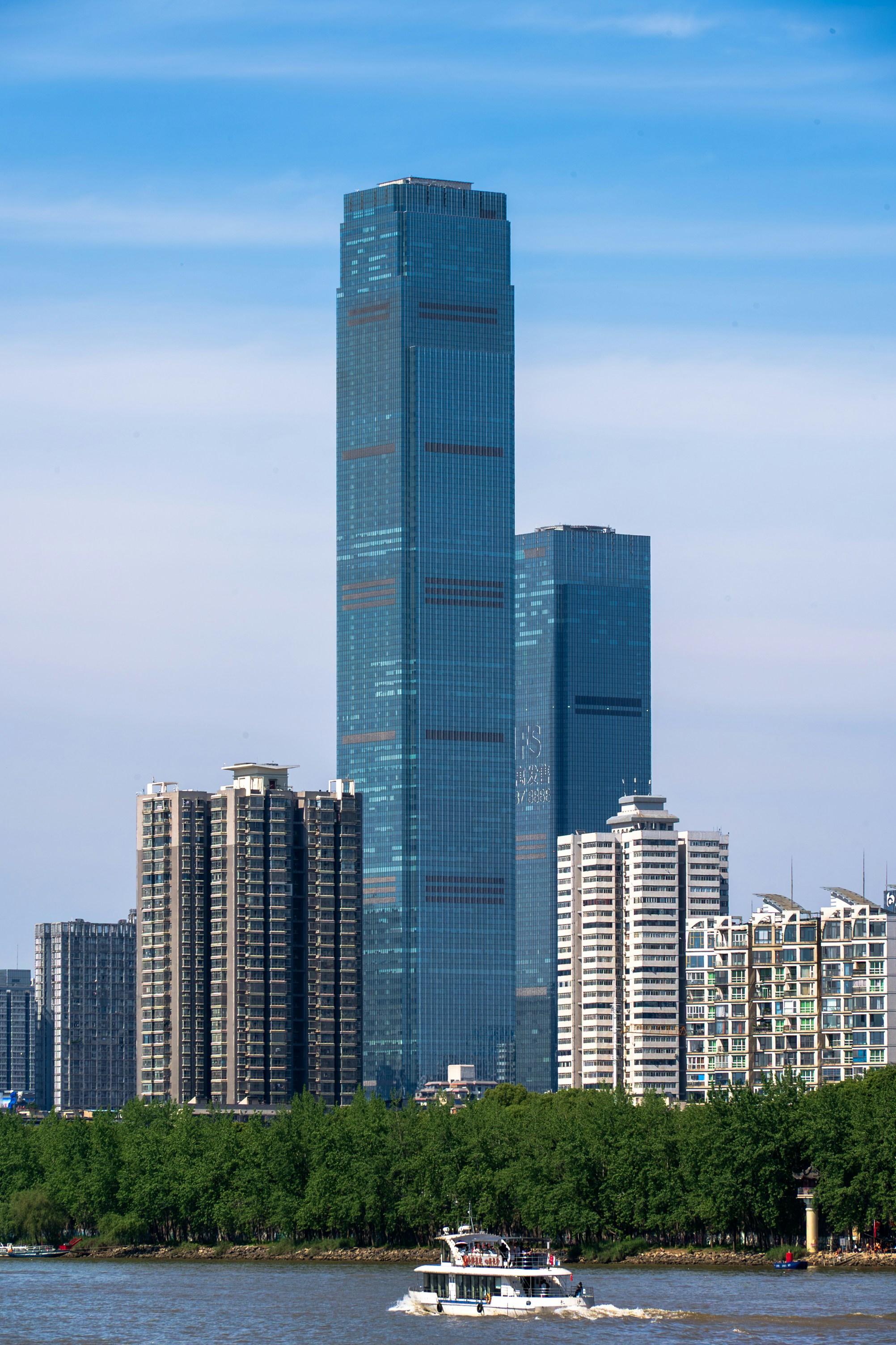 Towering Glass: Urban Skyline Rising Over Riverside Green