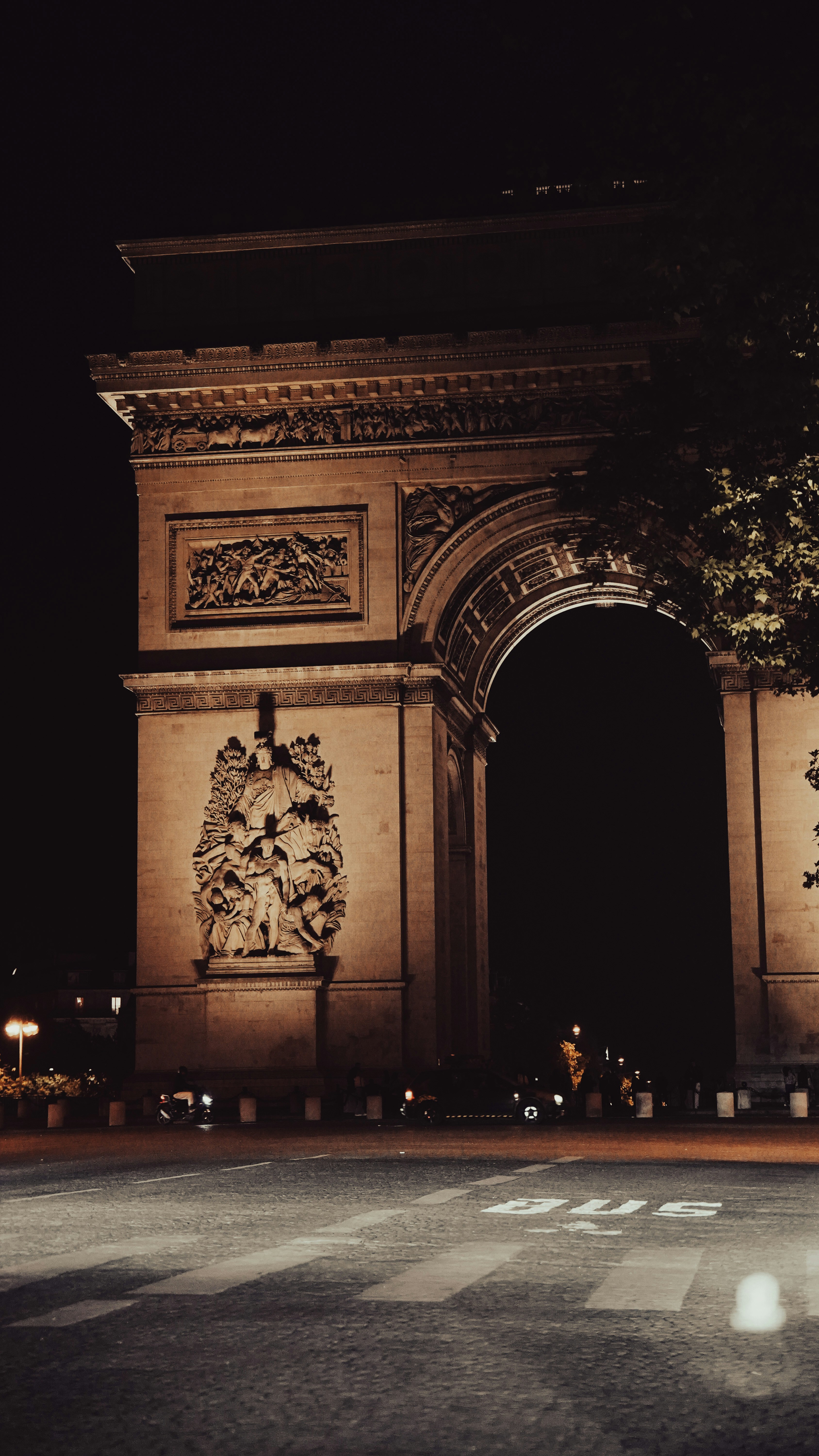 Night Archway: Illuminated Monument under Streetlights