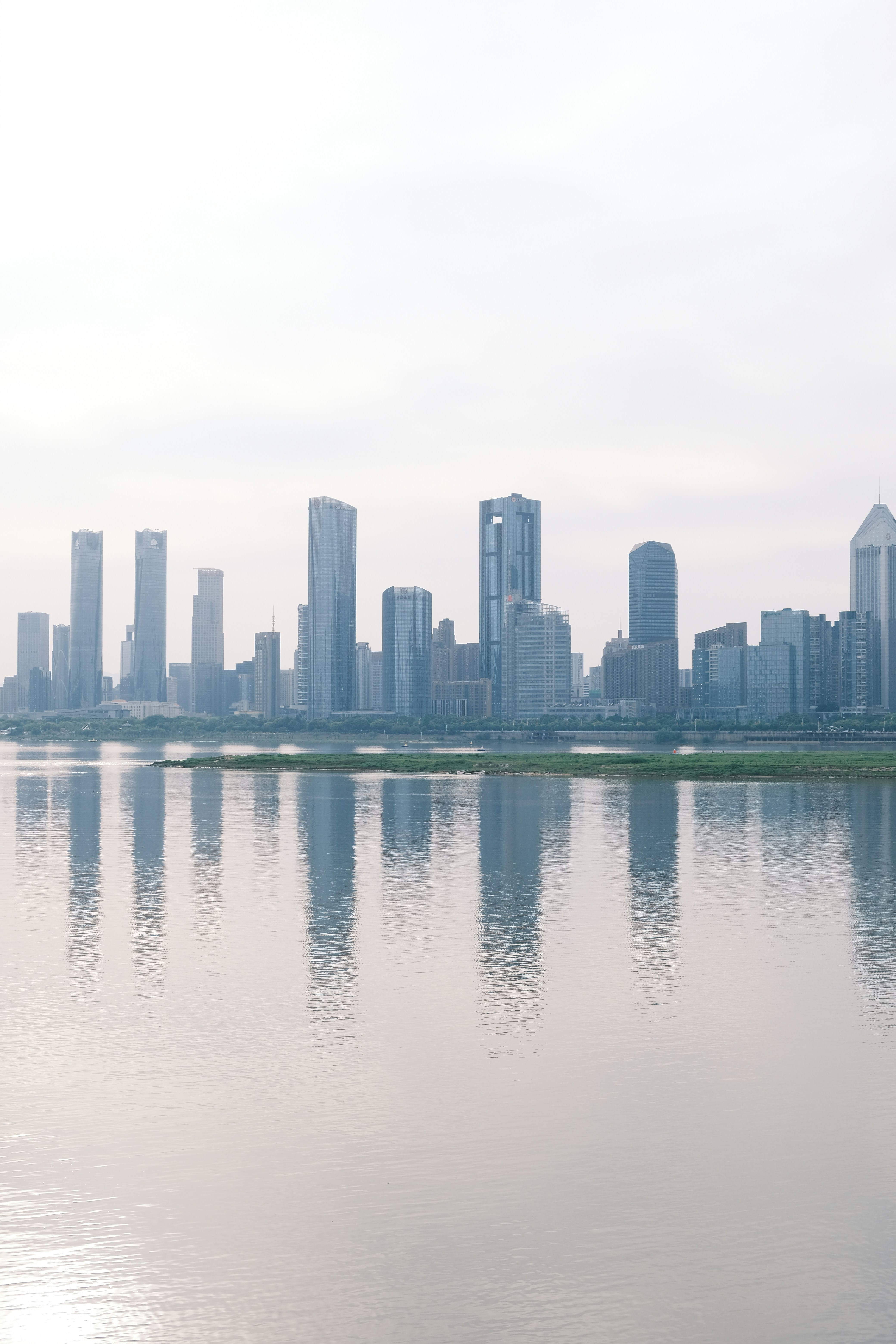 City Reflections: Dawn Over the River Horizon
