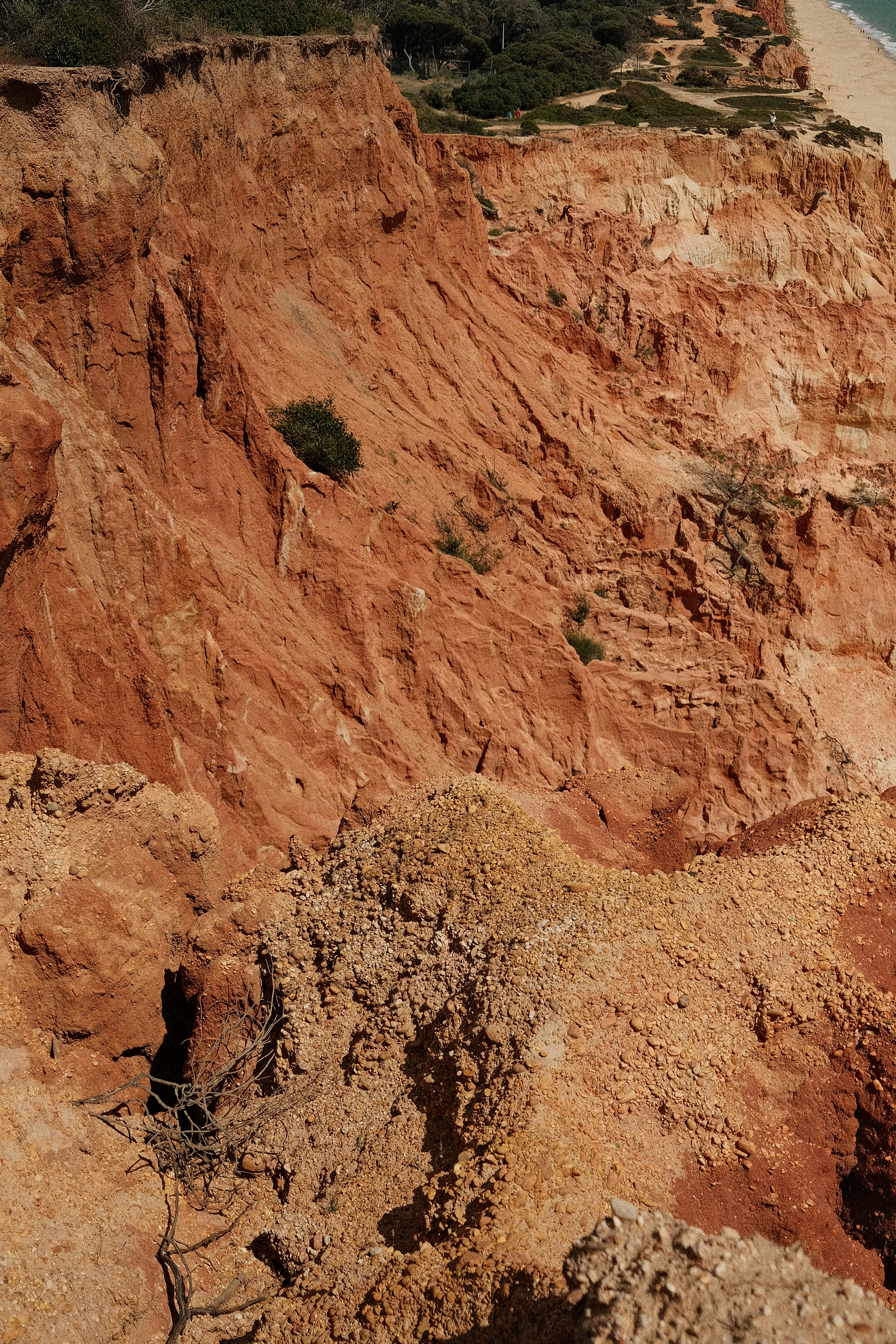 Crimson Cliffs Under a Quiet Coastal Sky