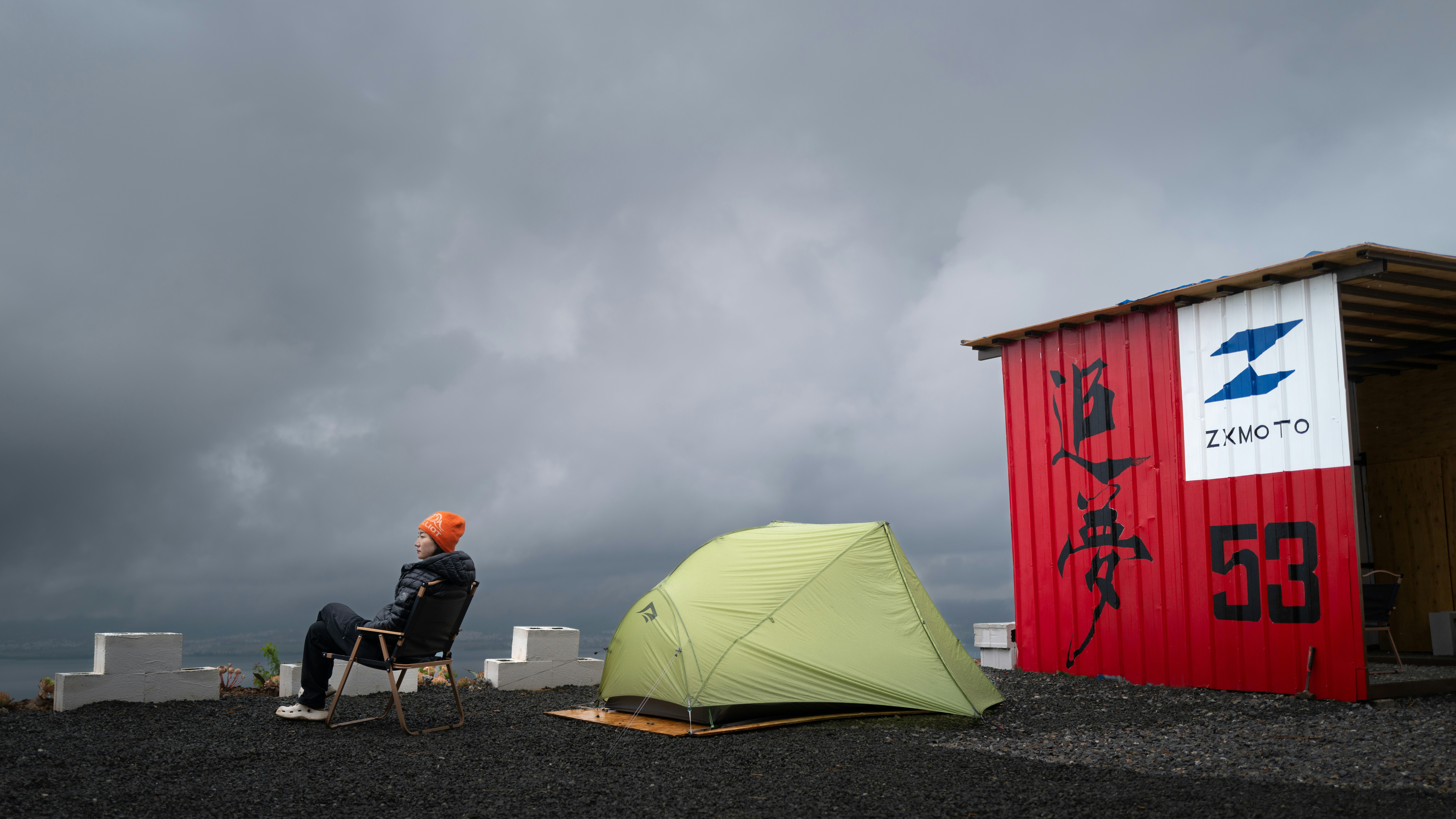 Alpine Camp Under Storm-touched Skies