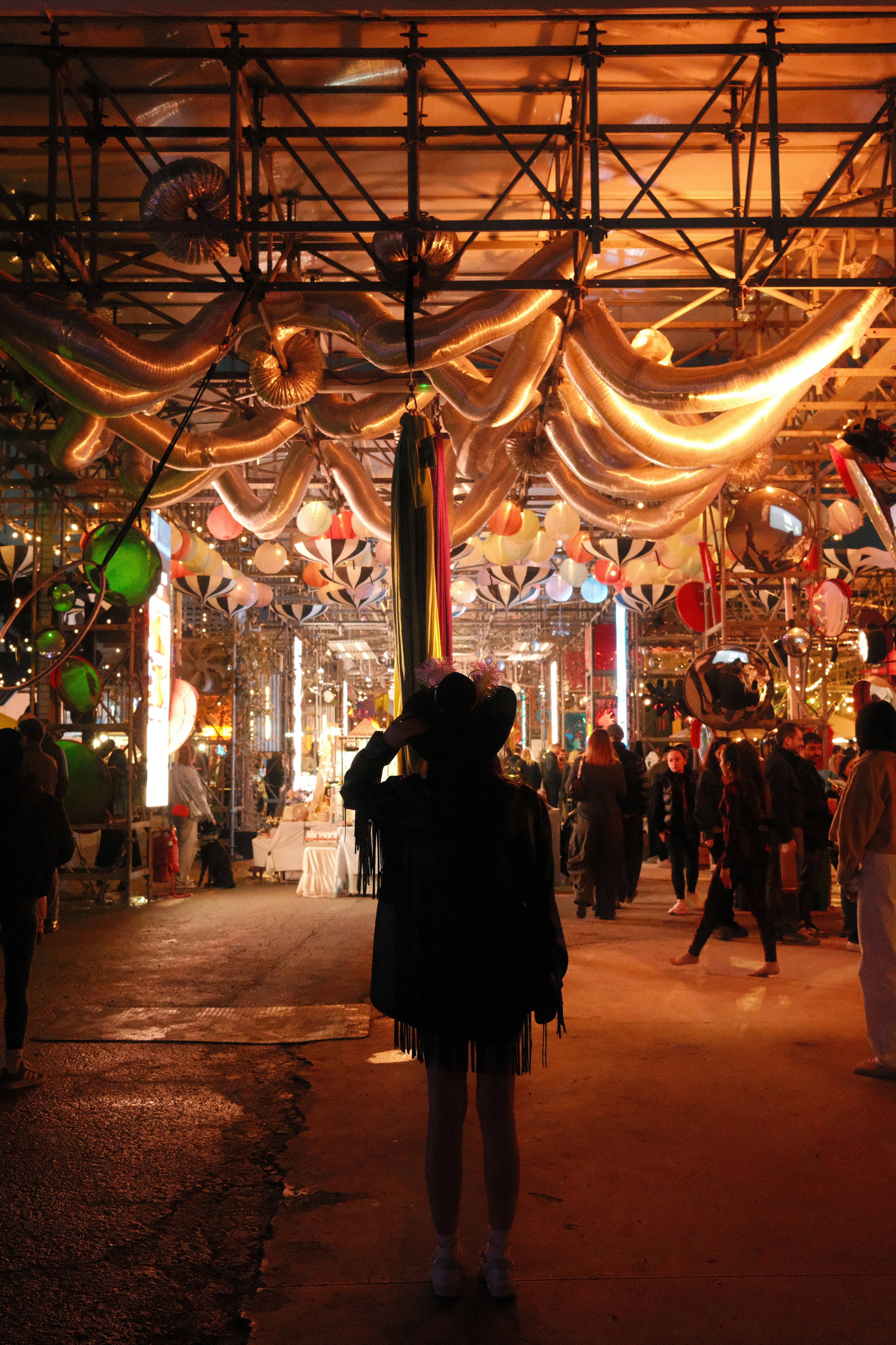 Midnight Carnival: A Silhouette Among the Lanterns