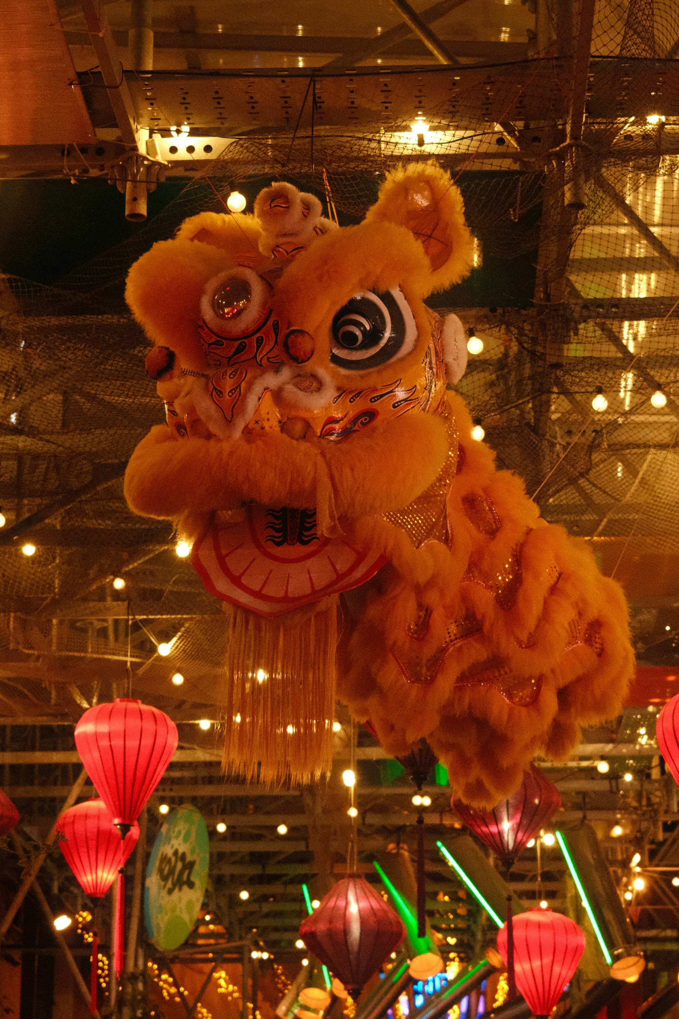 Golden Lion Lantern: Primary Masked Guardian in a Festive Night Market
