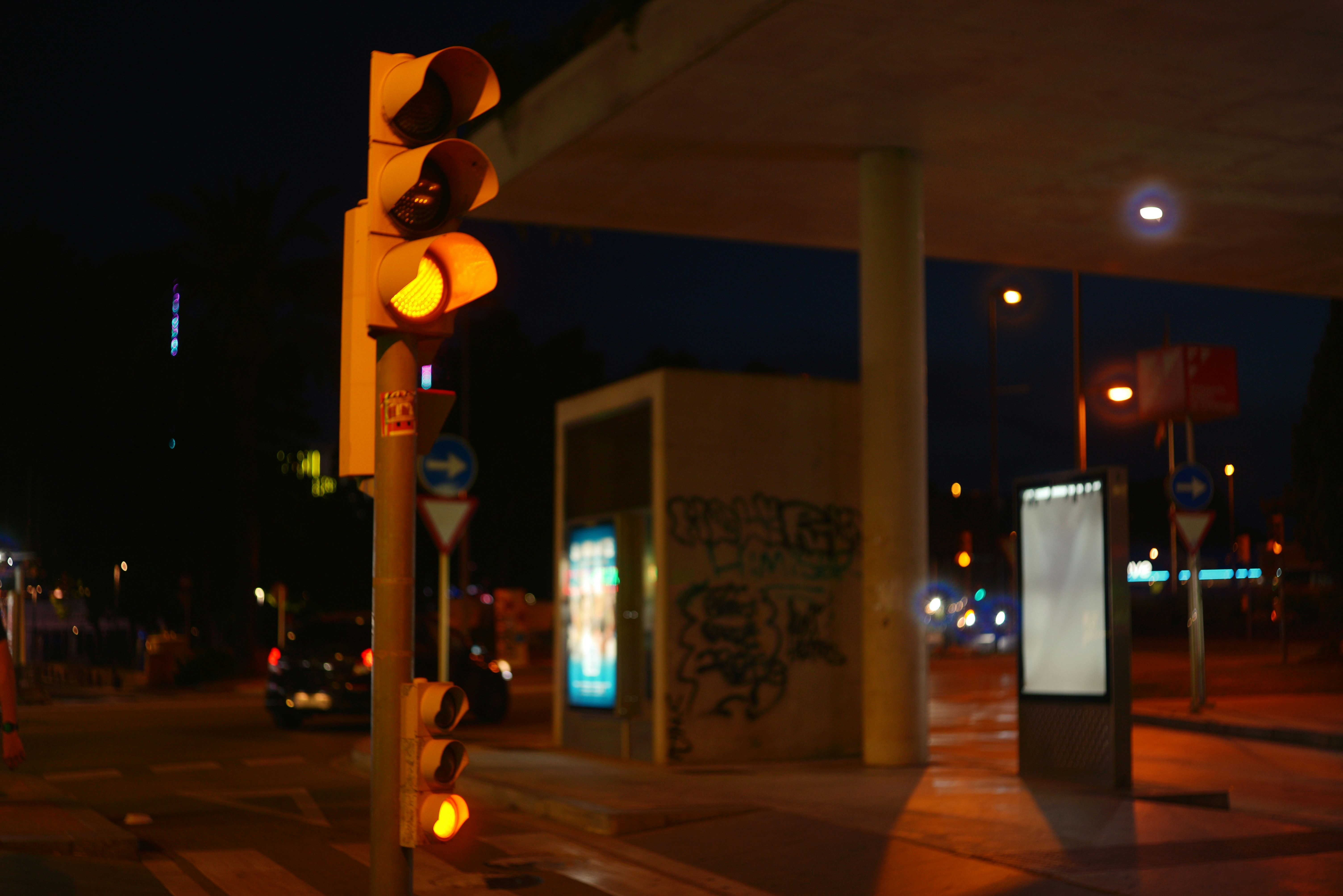 Neon Quiet: Nighttime Street Corner with Red Signals