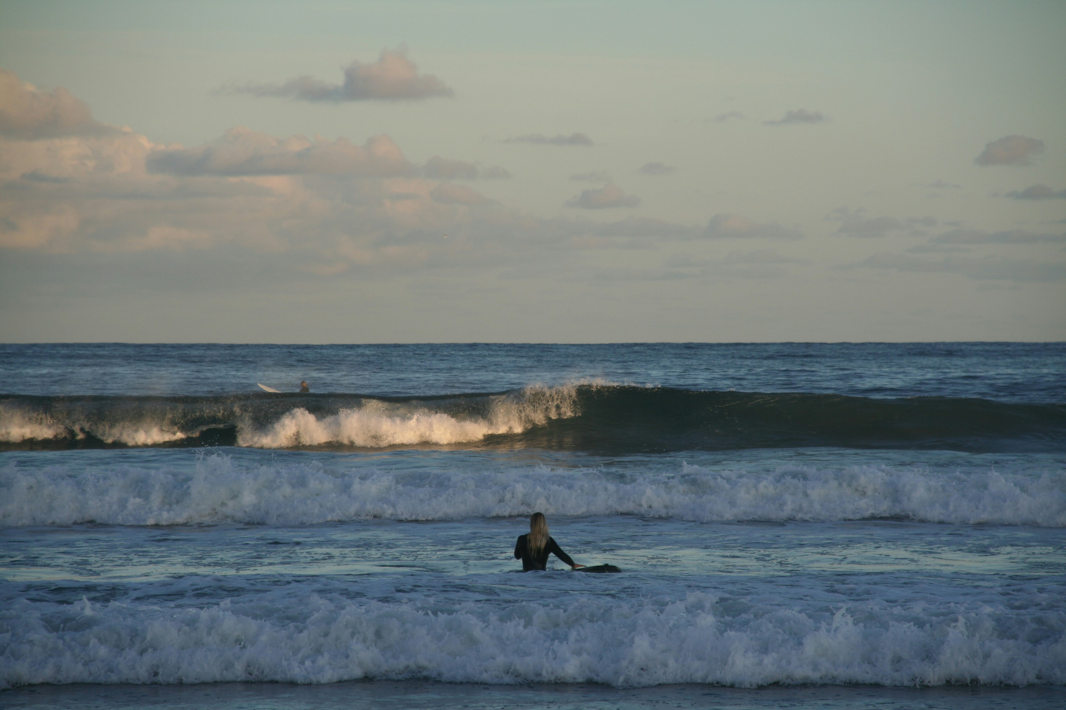 Solitary Surfer Amid Rolling Atlantic Wells