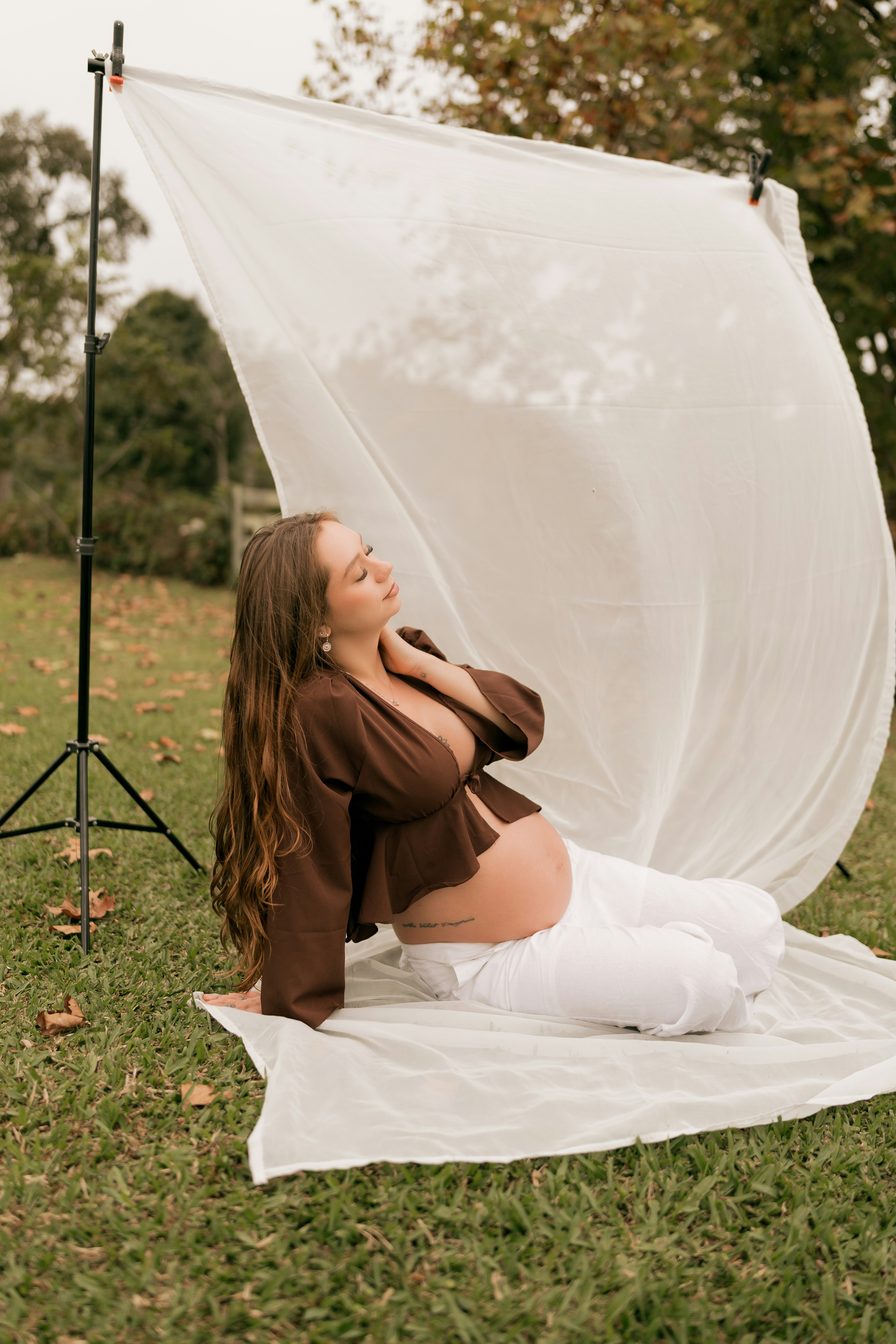 Pregnant Quietude Under a Veil of White