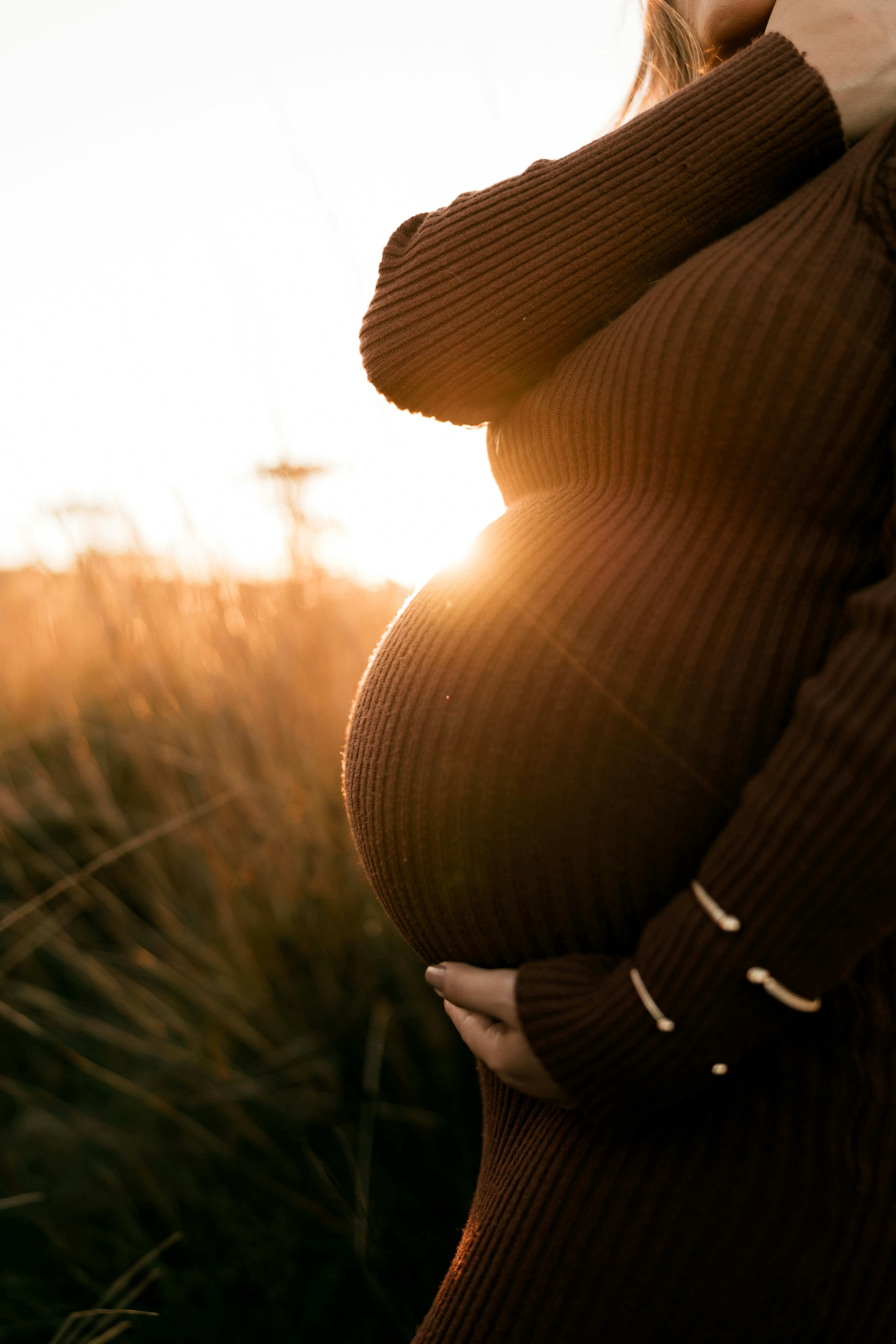 Golden Hour Contour: A Expectant Silhouette in Soft Backlight