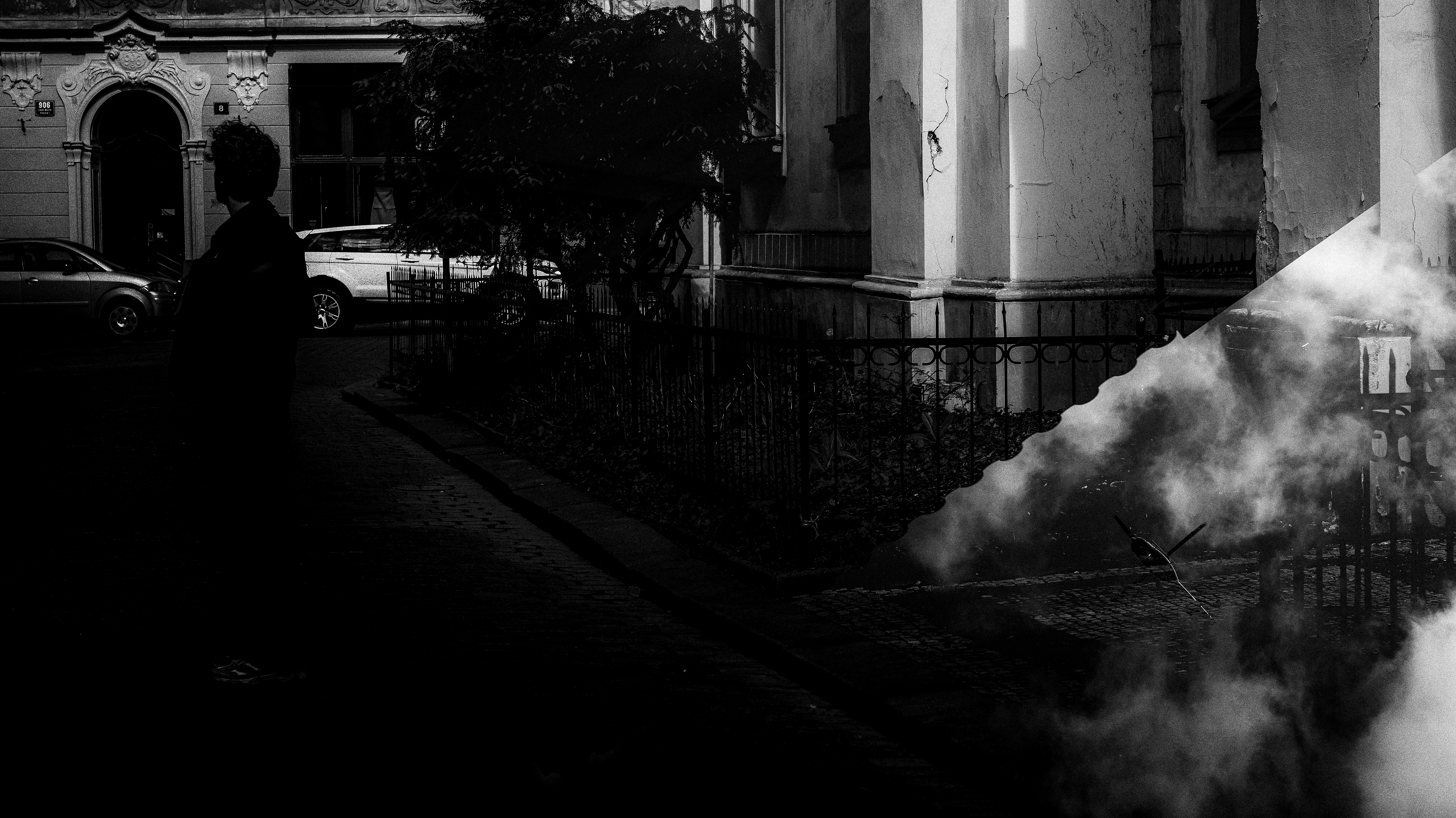 Shadowed street, steam and silhouette