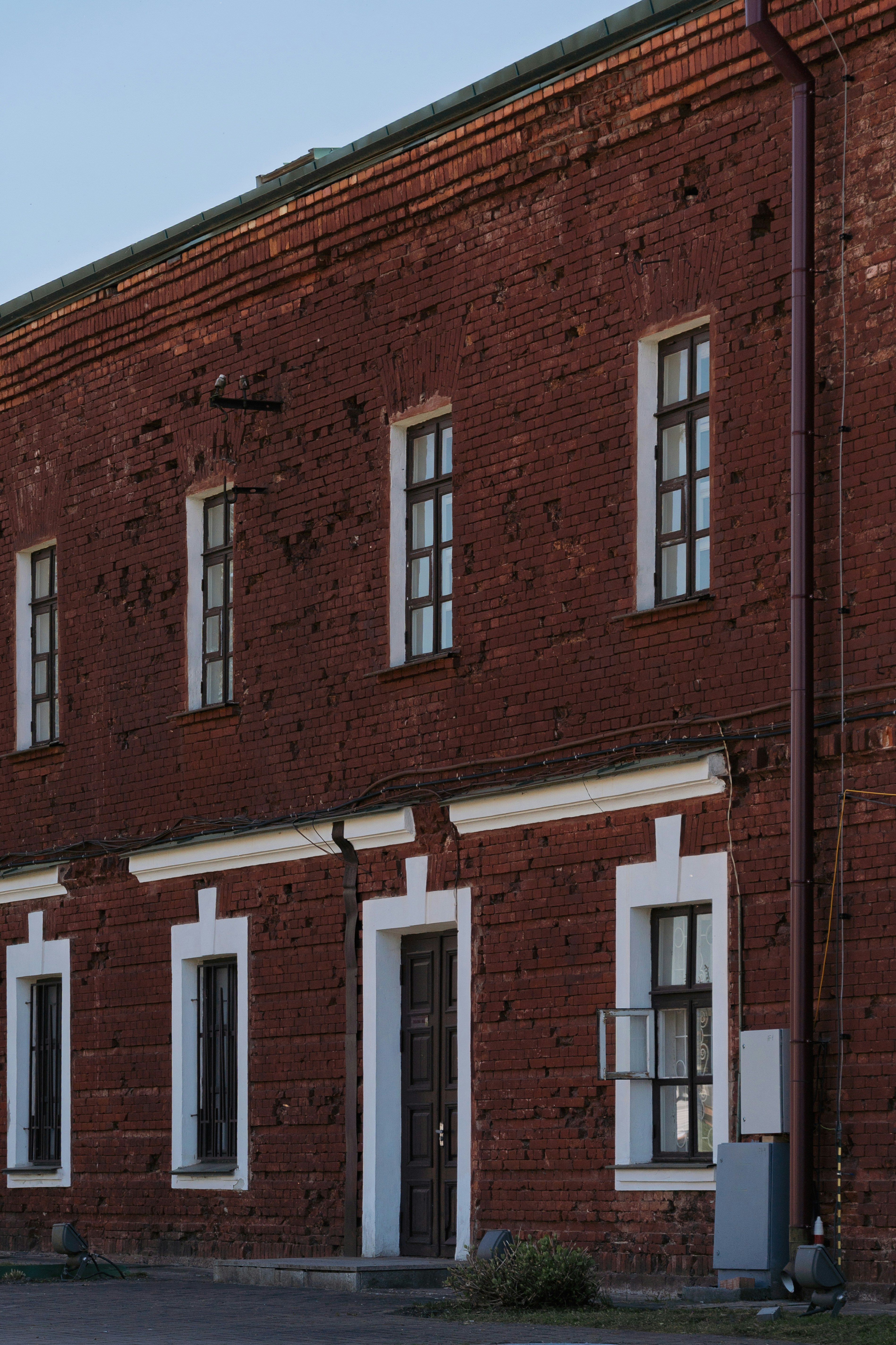 Brick Facade Windows: A Quiet Street Portrait