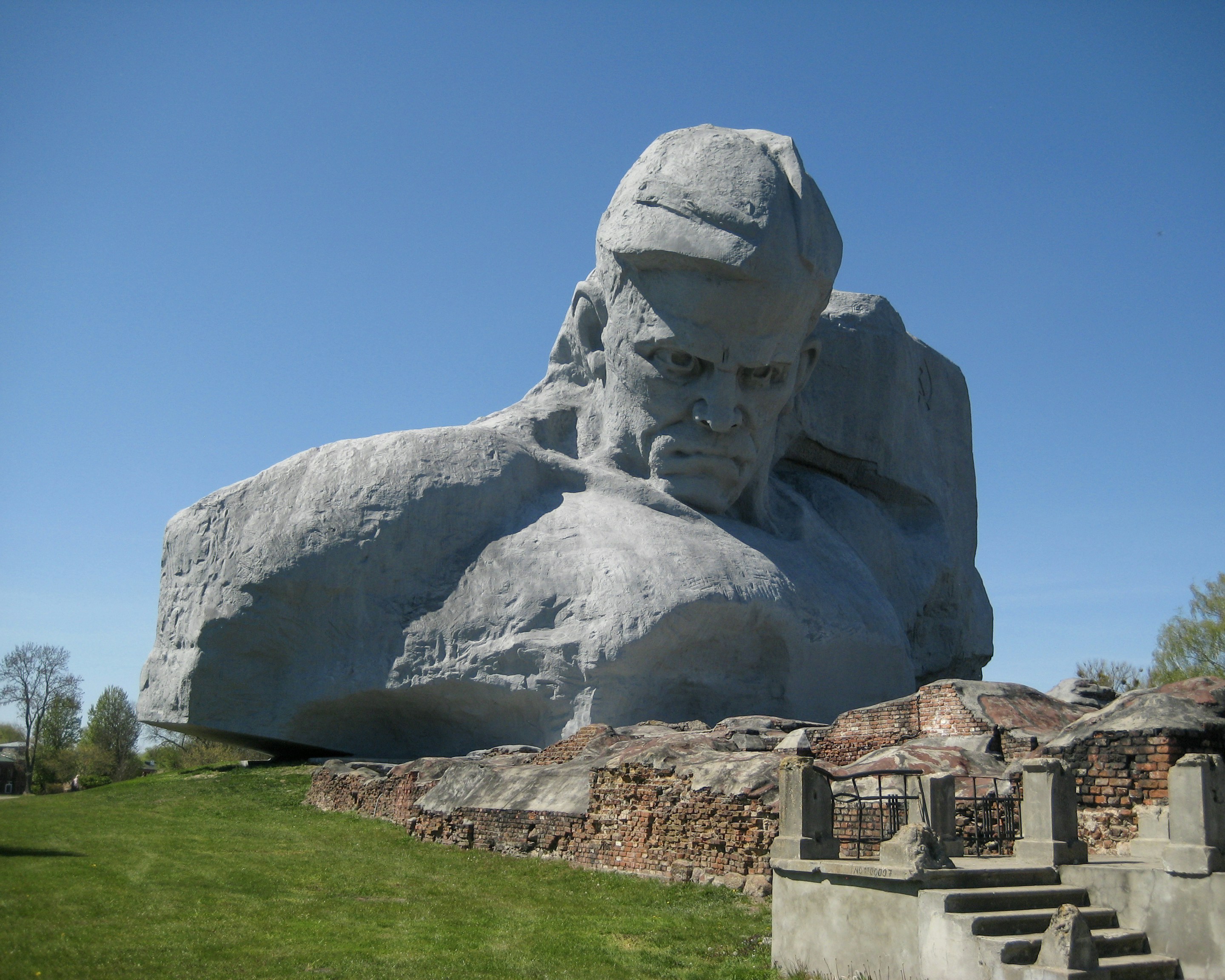 Giant Stone Portrait Rising from the Green Field