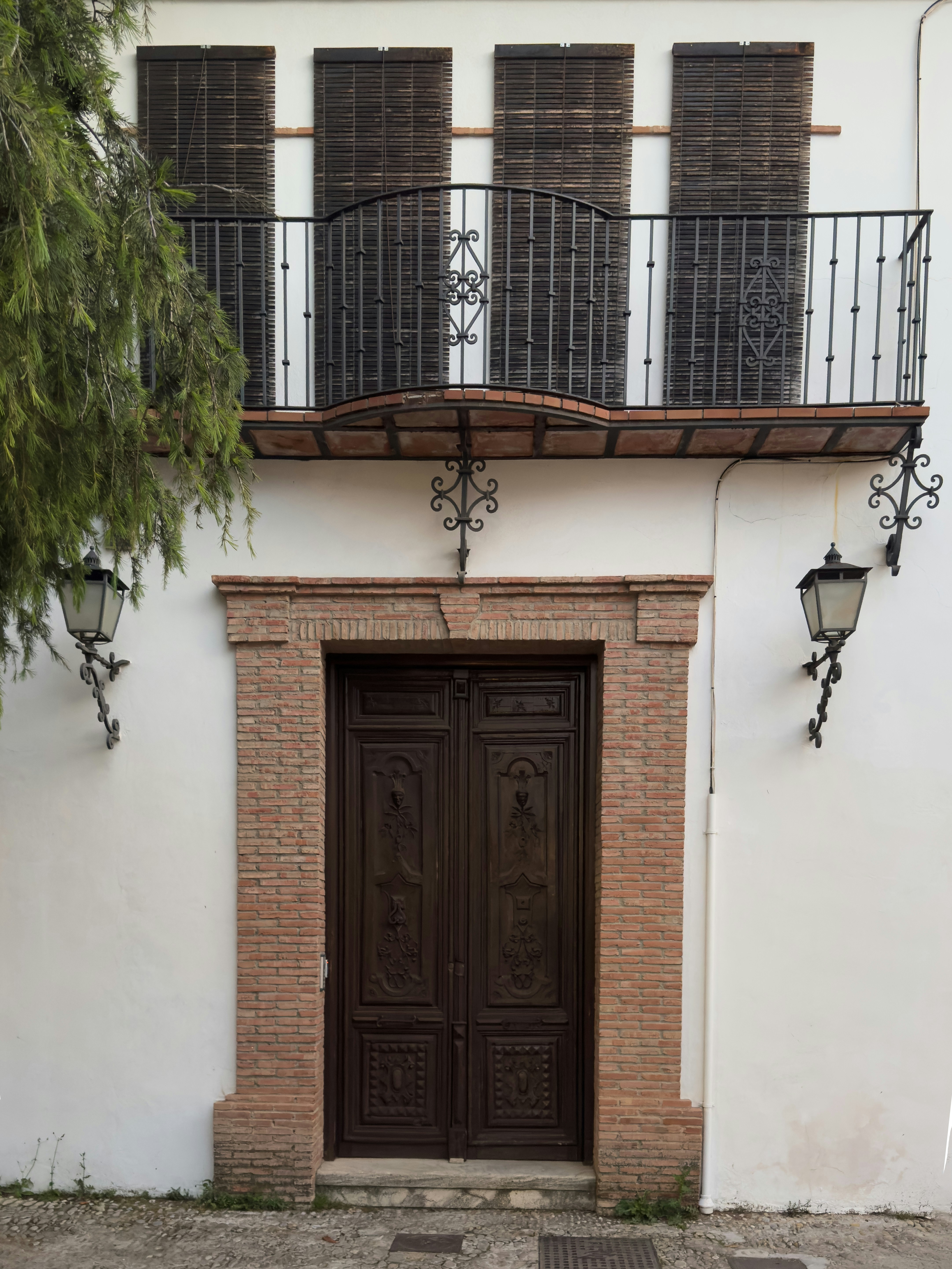 Heritage Doorway Under a Wrought‑Iron Balcony