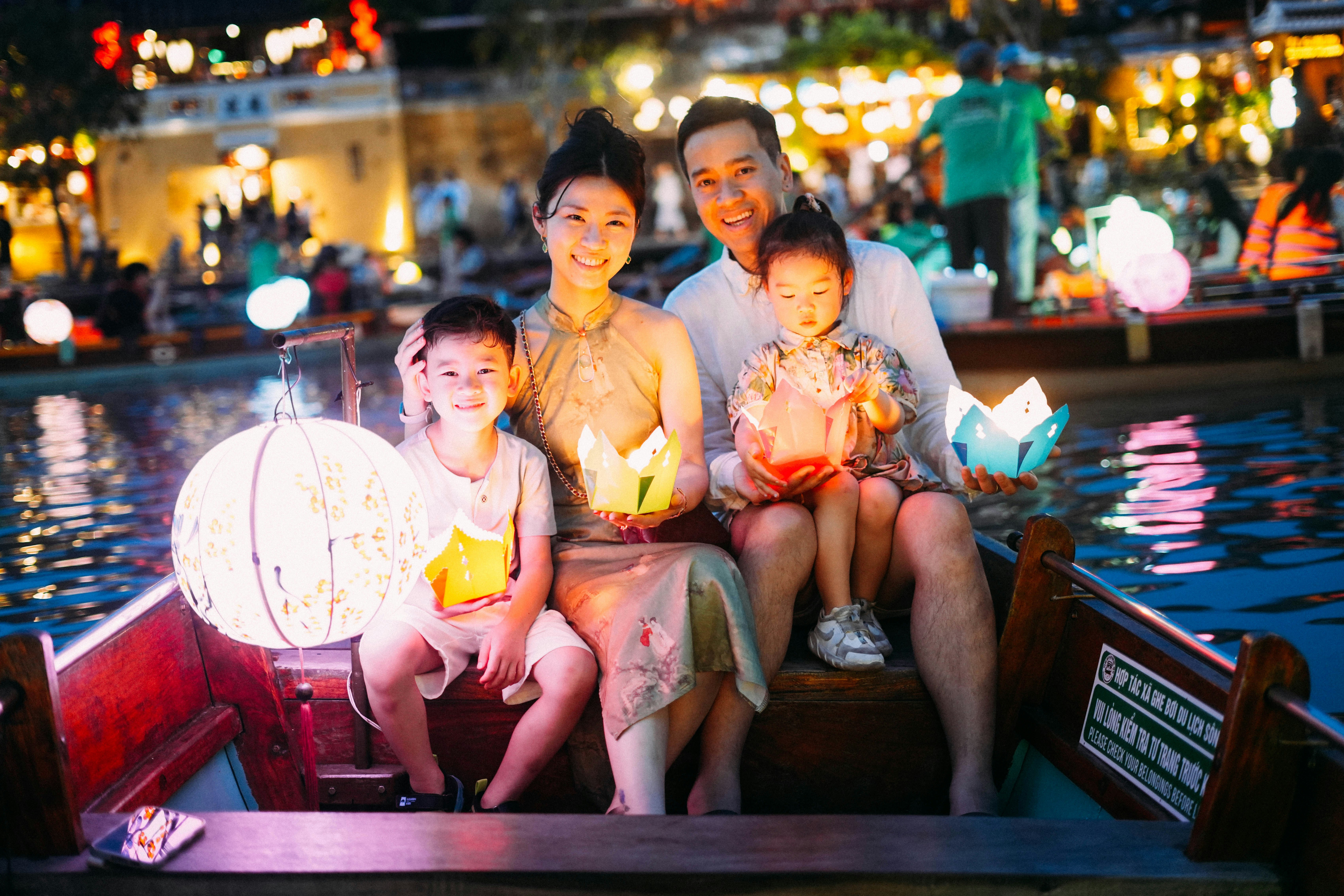 Family Lanterns on the Water: Evening Portrait in a Festival Boat