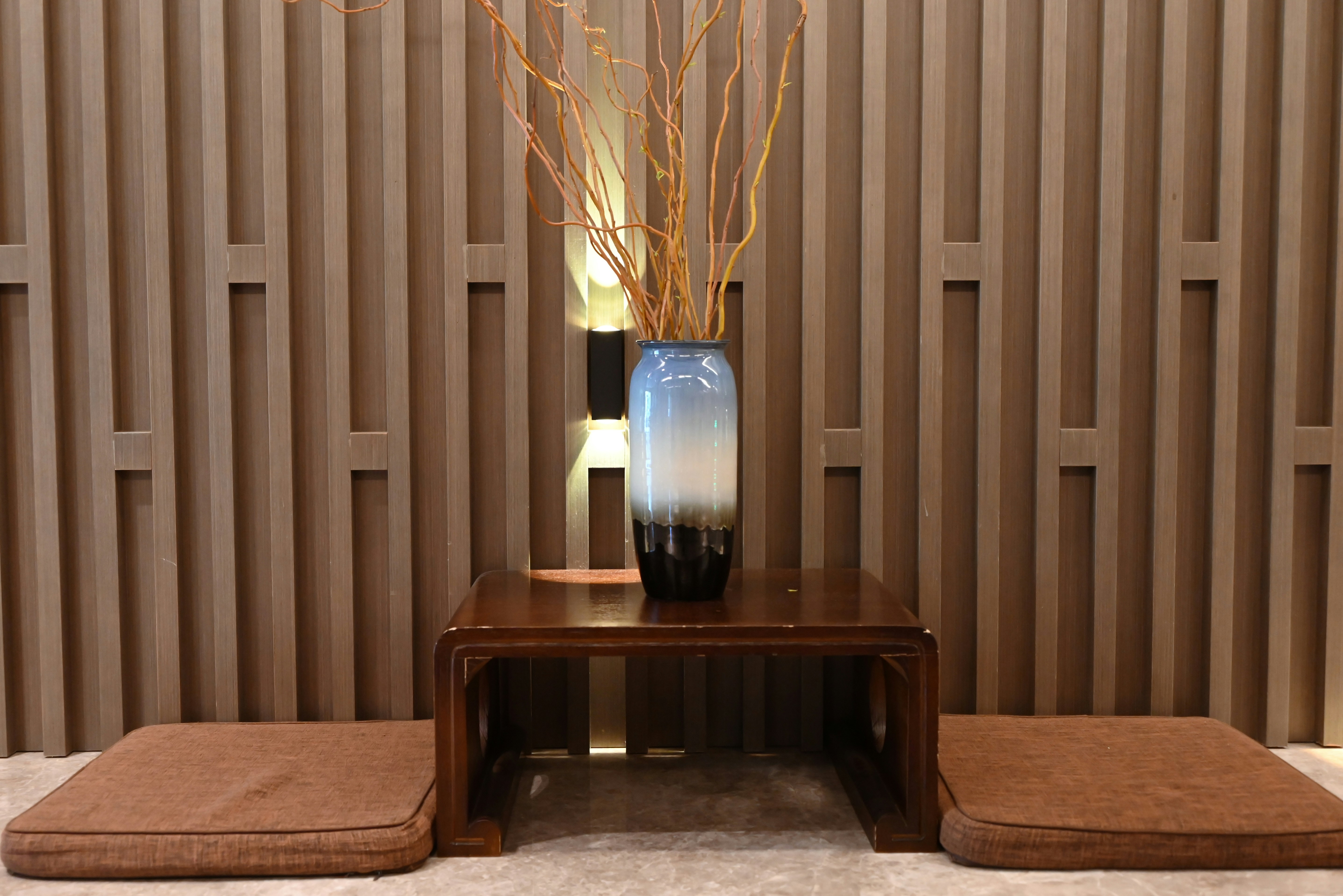 Minimalist Zen Table Vase in Warm Wood Paneled Lounge