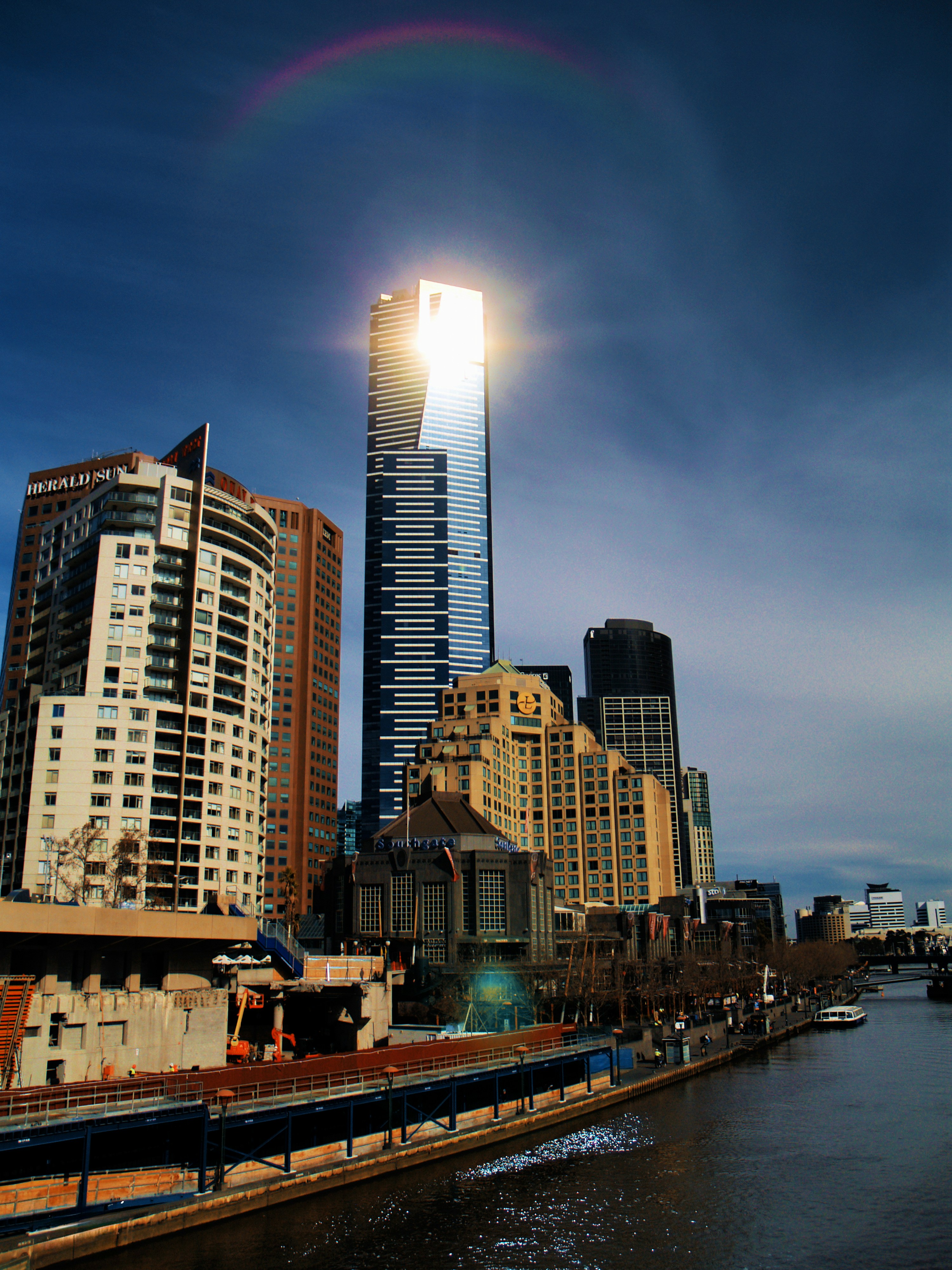 Sunlit Tower Crowned by Light over the Riverfront